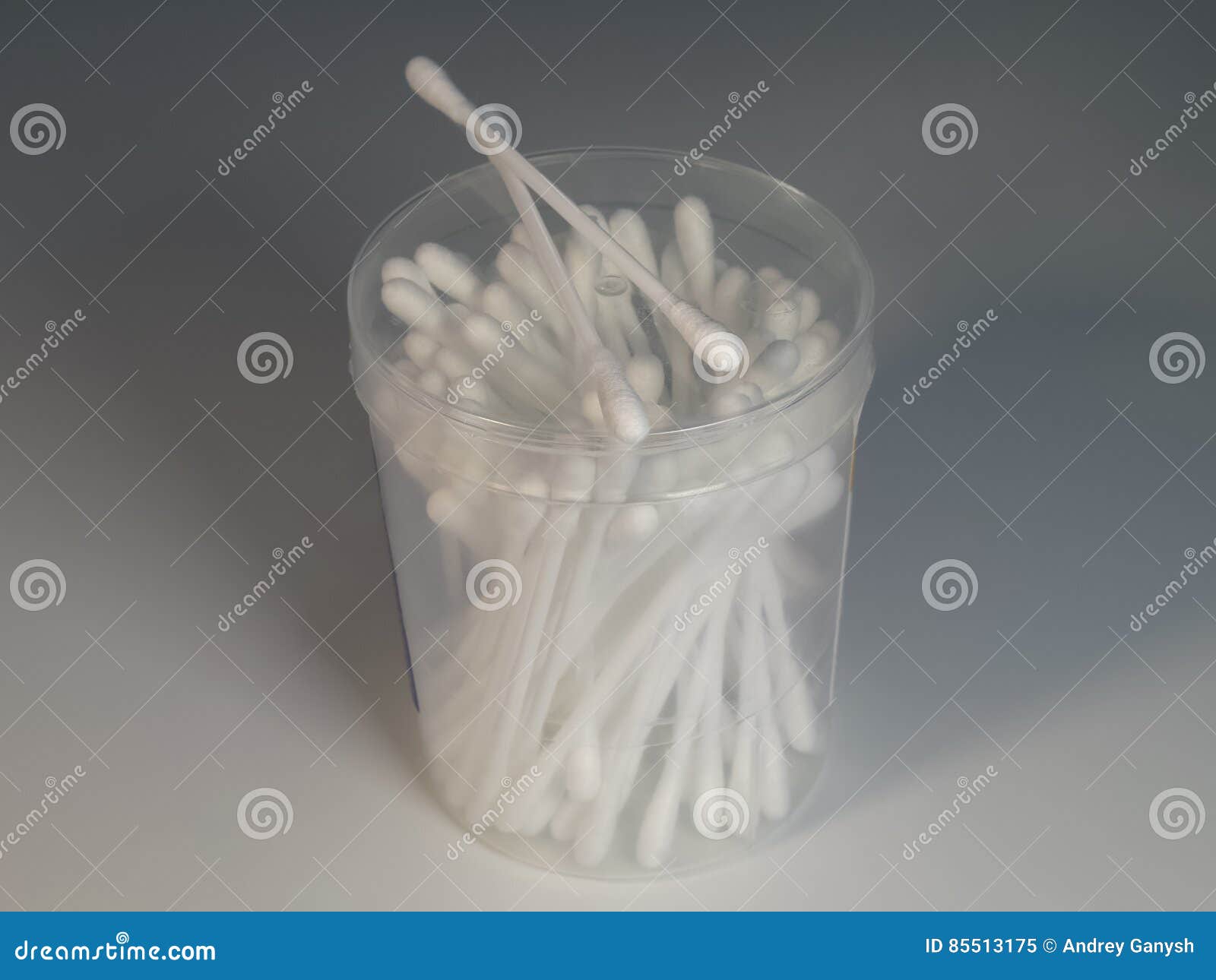 Round Transparent Box with White Cotton Sticks To the Ears Stock Image ...