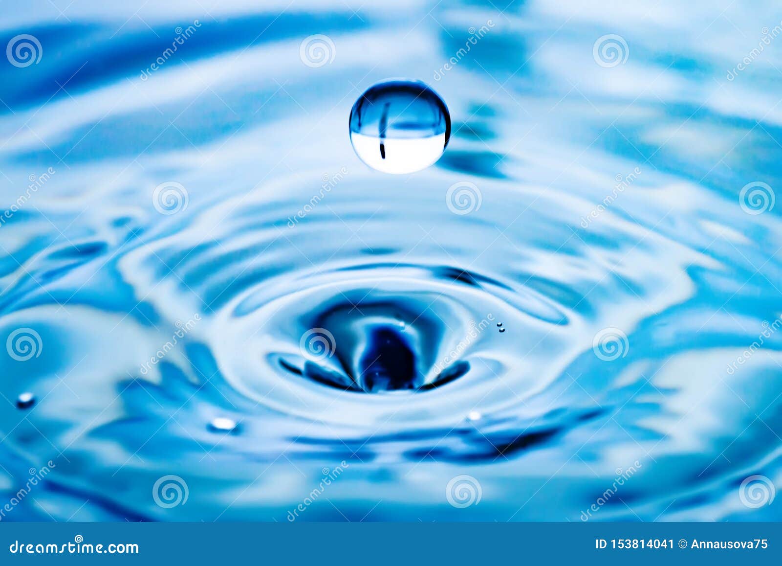 The Round Transparent Drop of Water, Falls Downwards. Selective Focus ...