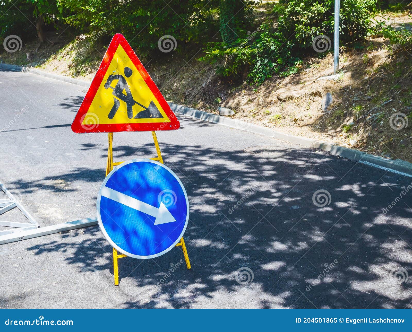Round and Triangular Signs Standing on the Road Symbolizing Road ...