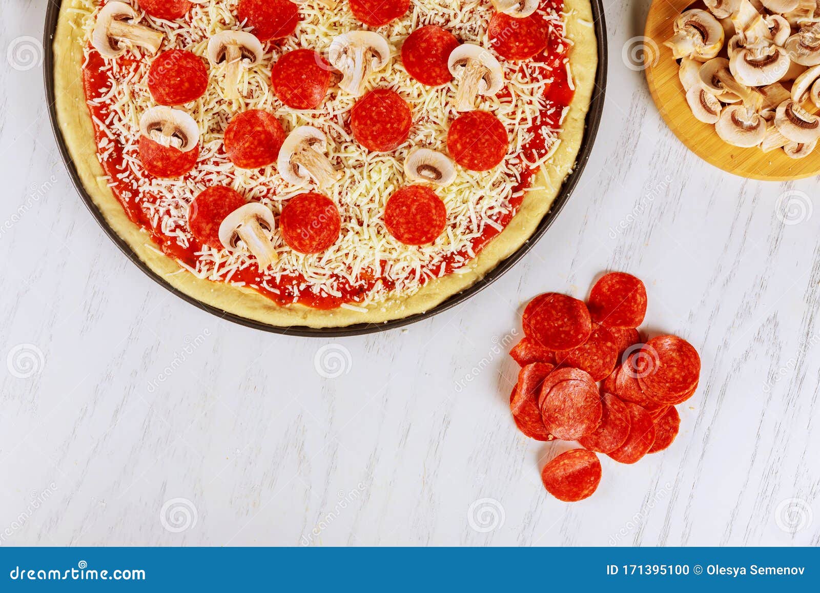 Round Uncooked Pizza with Pepperoni and Mushroom Stock Photo - Image of ...