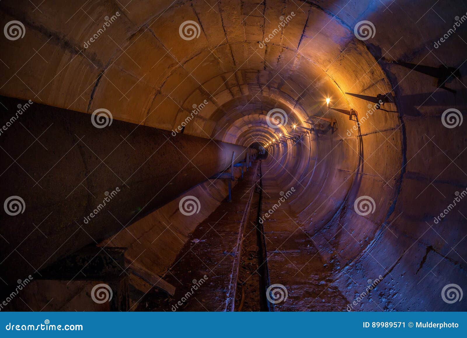 Round Underground Technical Tunnel of Heating Duct with Rusty Pipeline ...