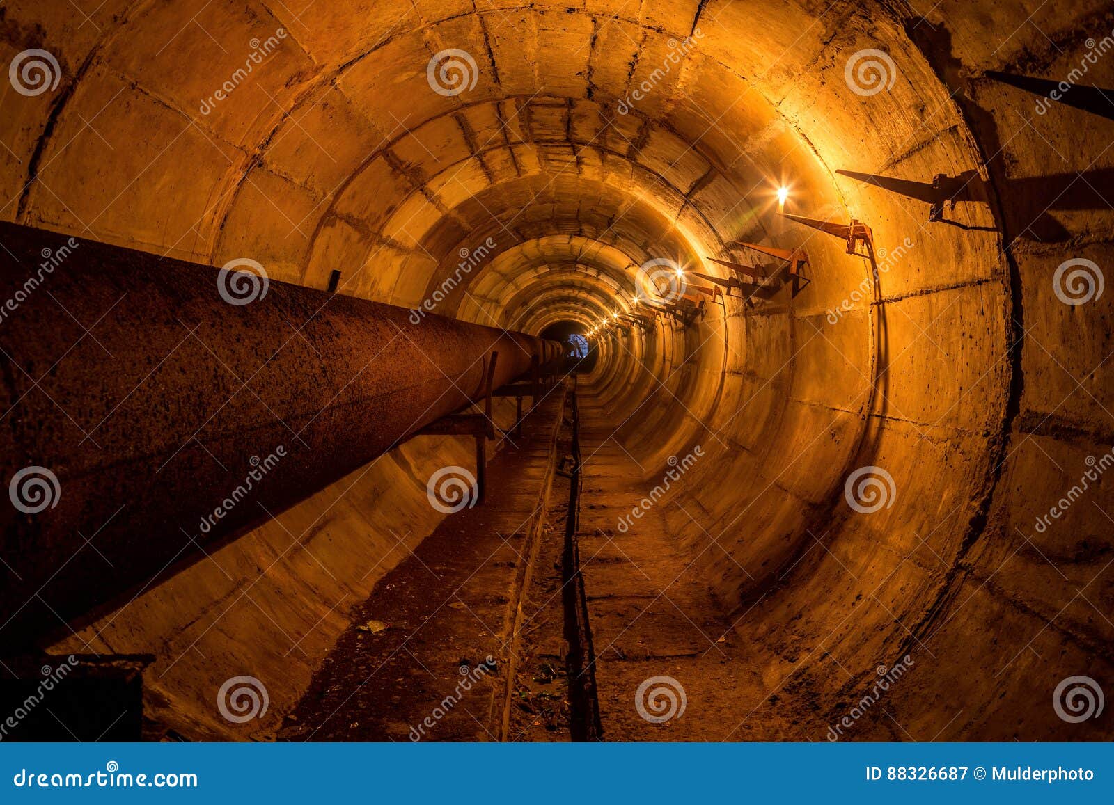 Round Underground Technical Tunnel of Heating Duct with Rusty Pipeline ...