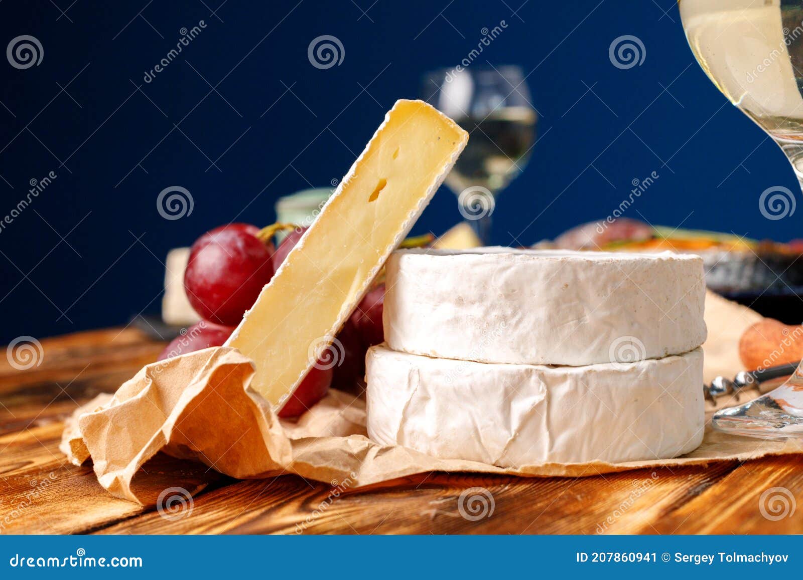 Round White Cheese with Grapes on Wooden Table Stock Image - Image of ...