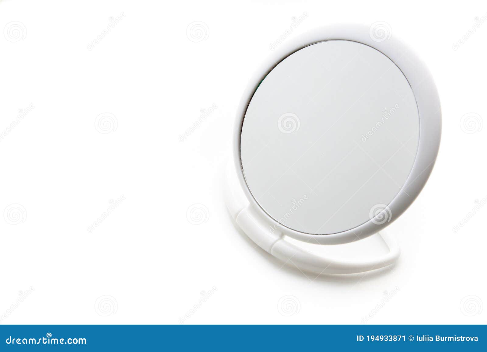 Round White Plastic Mirror on a White Plastic Stand on a White ...