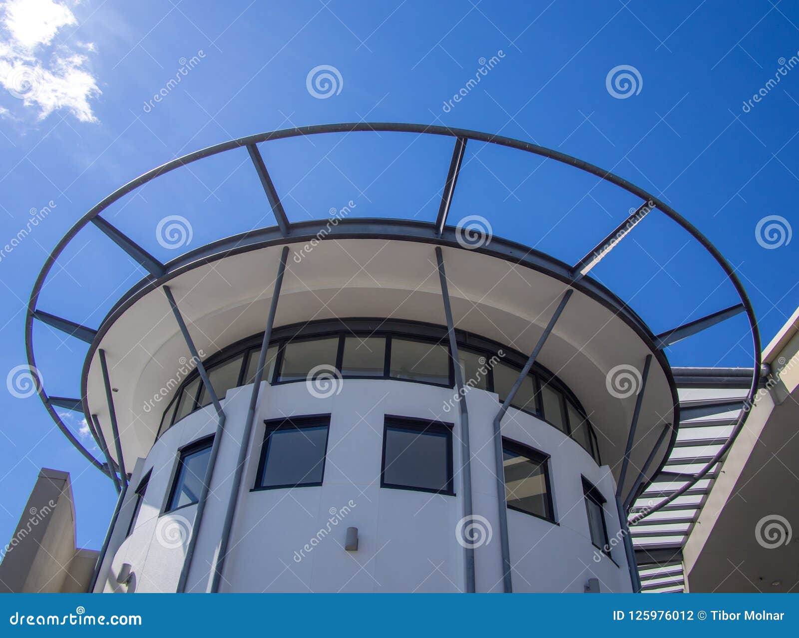 Round White Top of a Modern Building Against the Blue Sky Stock Photo ...