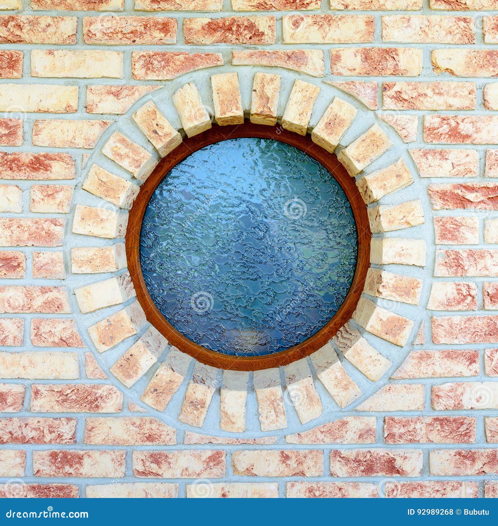 Round window on brick wall stock photo. Image of retro - 92989268