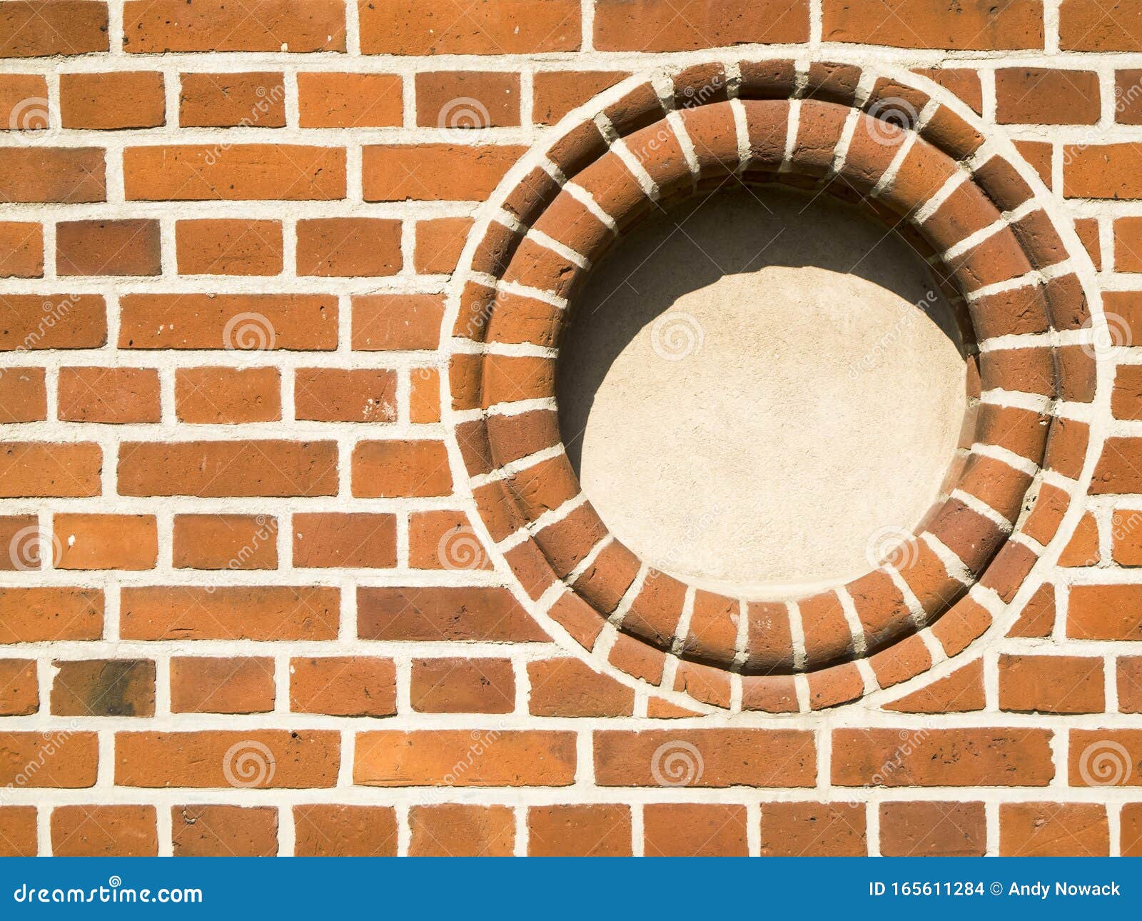 Round window in brick wall stock photo. Image of facade - 165611284