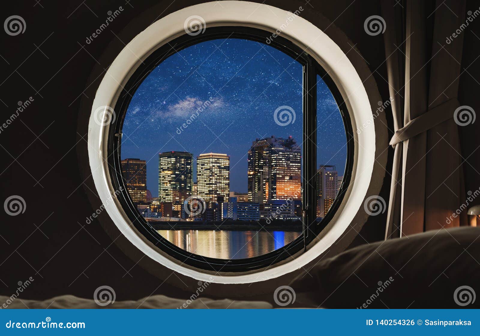 Round Window Frame in Bedroom at Night with City View Stock Photo ...