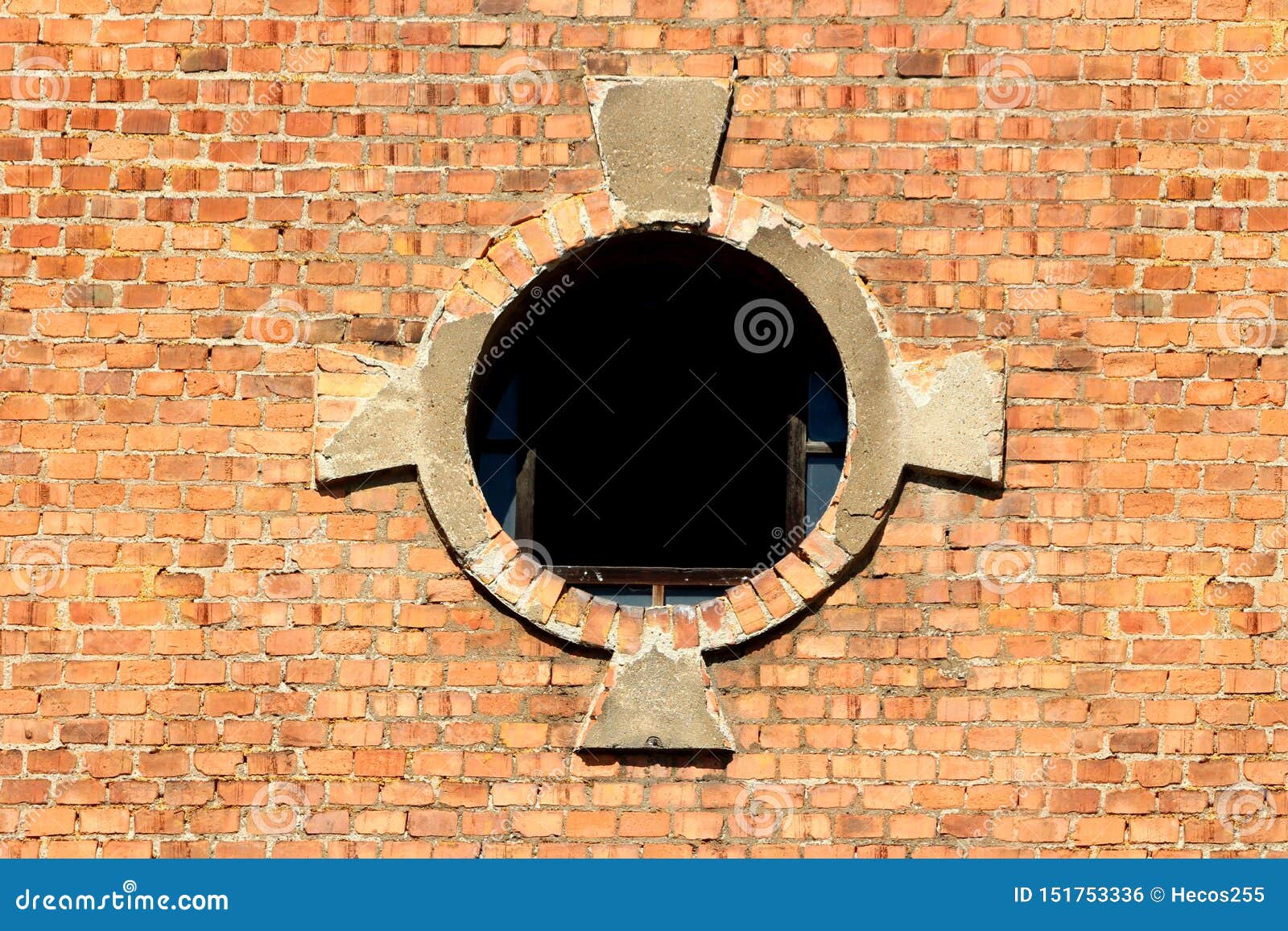 Round Window Opening with Partially Broken Glass and Decorative Red ...