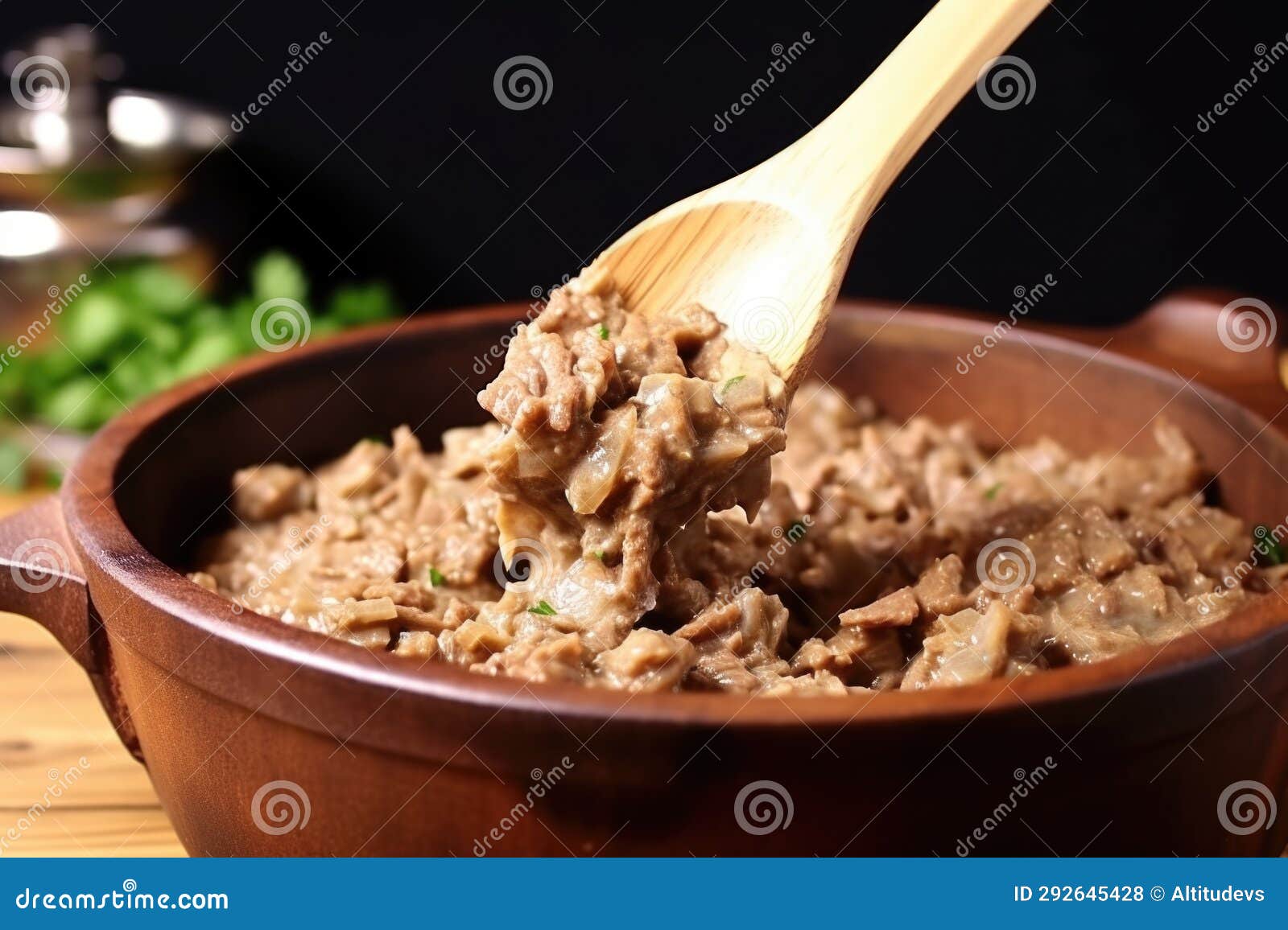 A Round Wooden Spoon Scooping Up Beef Stroganoff Stock Photo - Image of ...