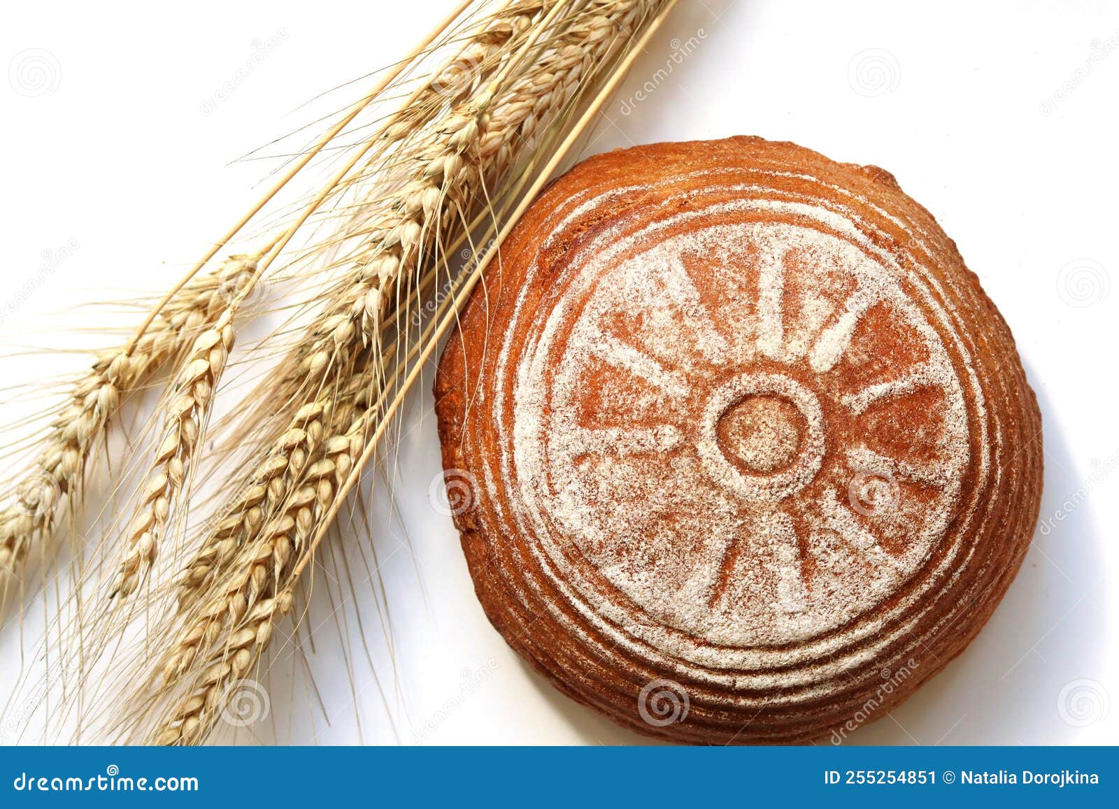 Round Yeast-free Rye Bread and Ears of Rye on a White Isolated ...