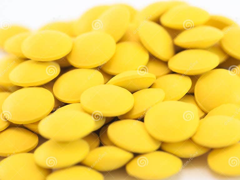 Round yellow pills stock photo. Image of yellow, vitamins - 15437462