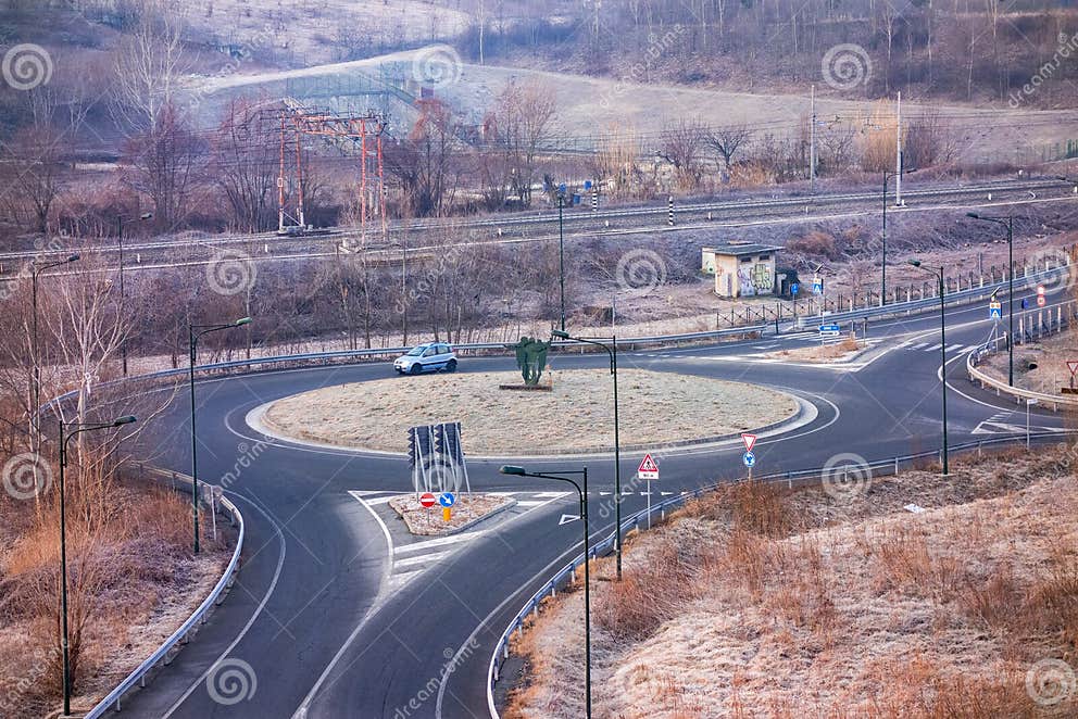 Roundabout with One Car and a Railroad Stock Image - Image of junction ...