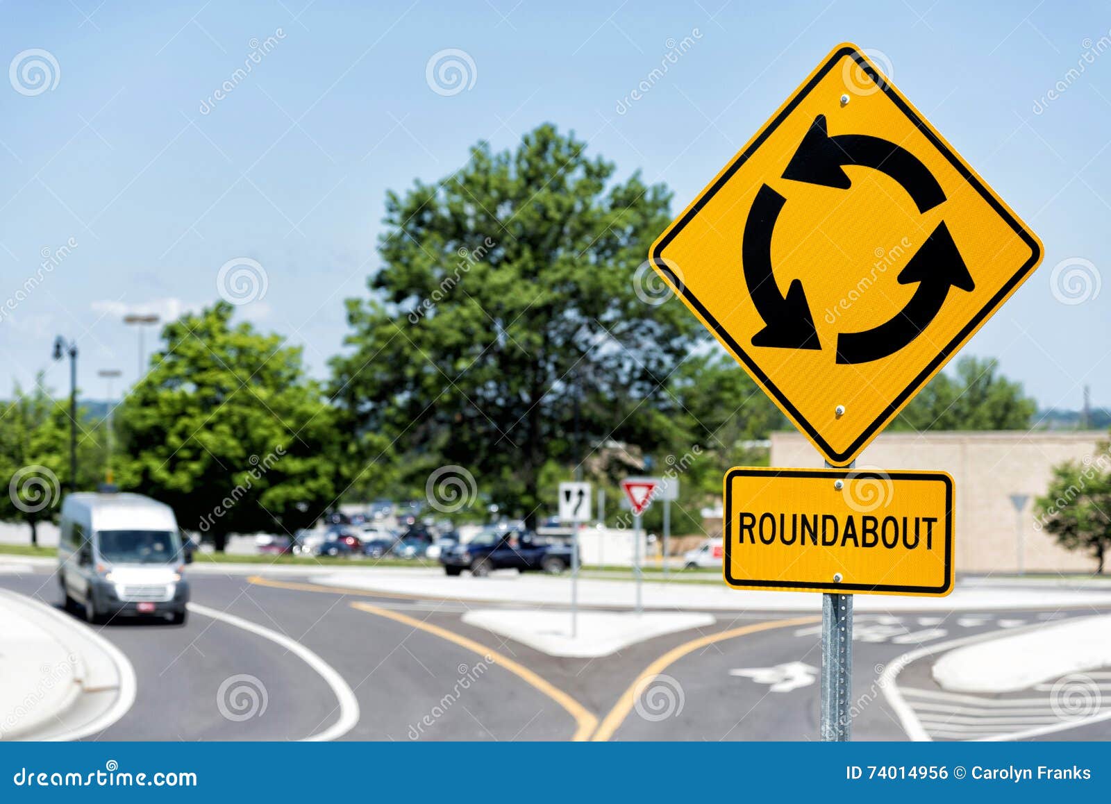 Roundabout Sign at Intersection Stock Photo - Image of daylight, truck ...