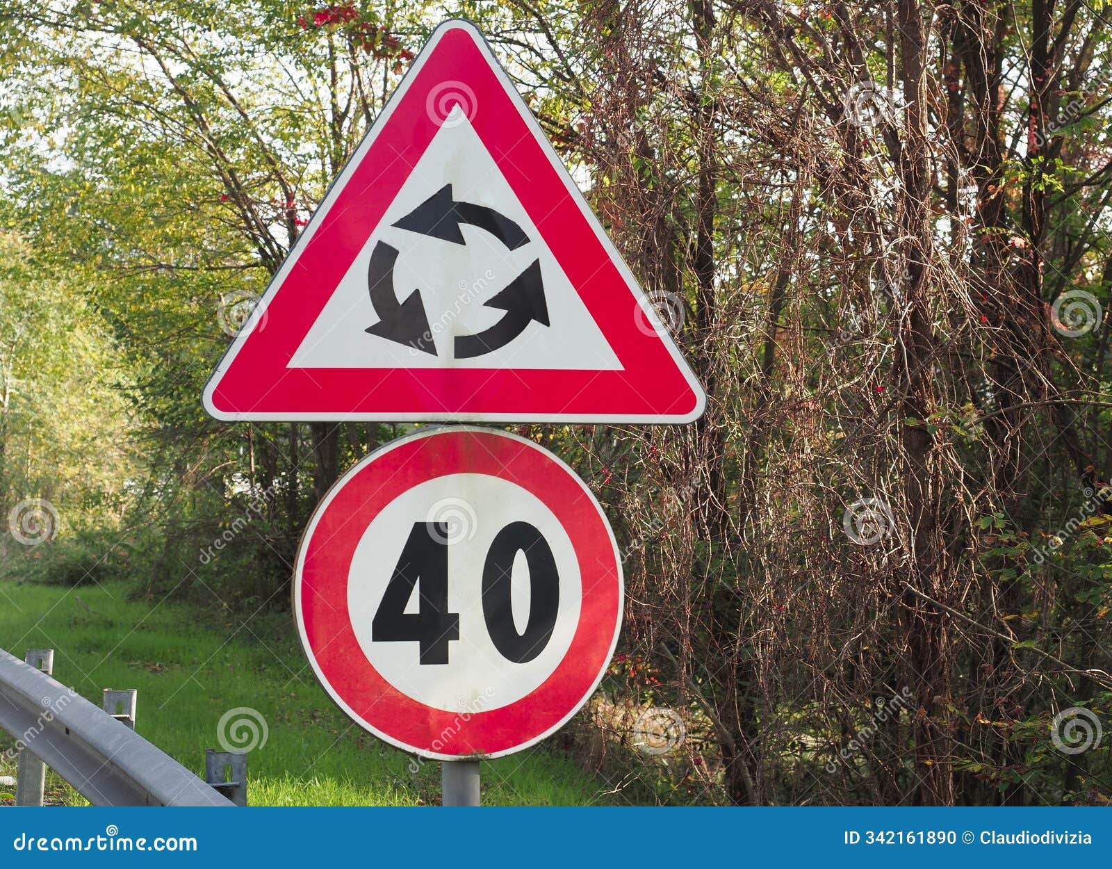 Roundabout and Speed Limit Sign Stock Photo - Image of roundabout ...