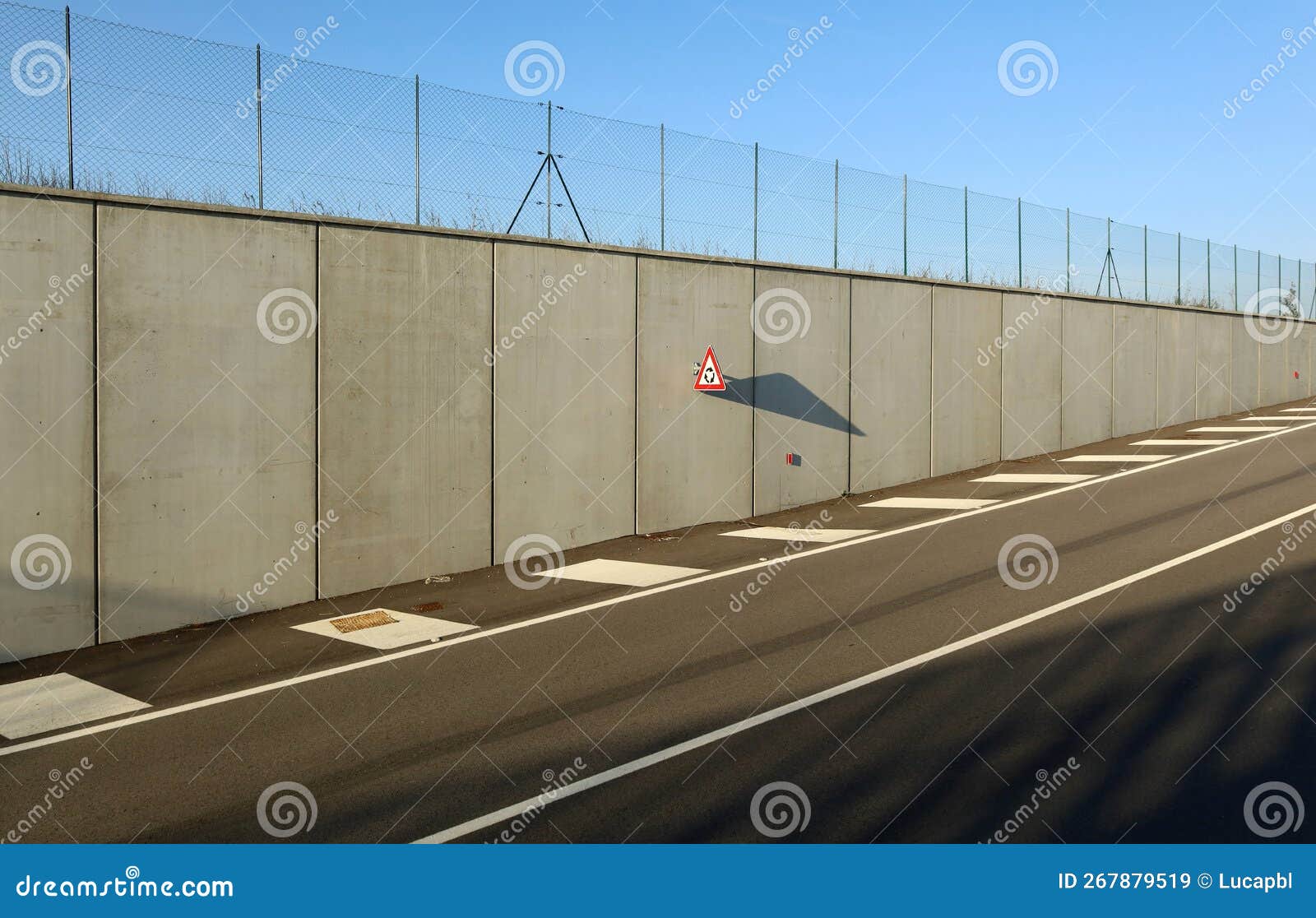 Roundabout Warning Triangle Road Sign, on Concrete Wall at the Exit of ...
