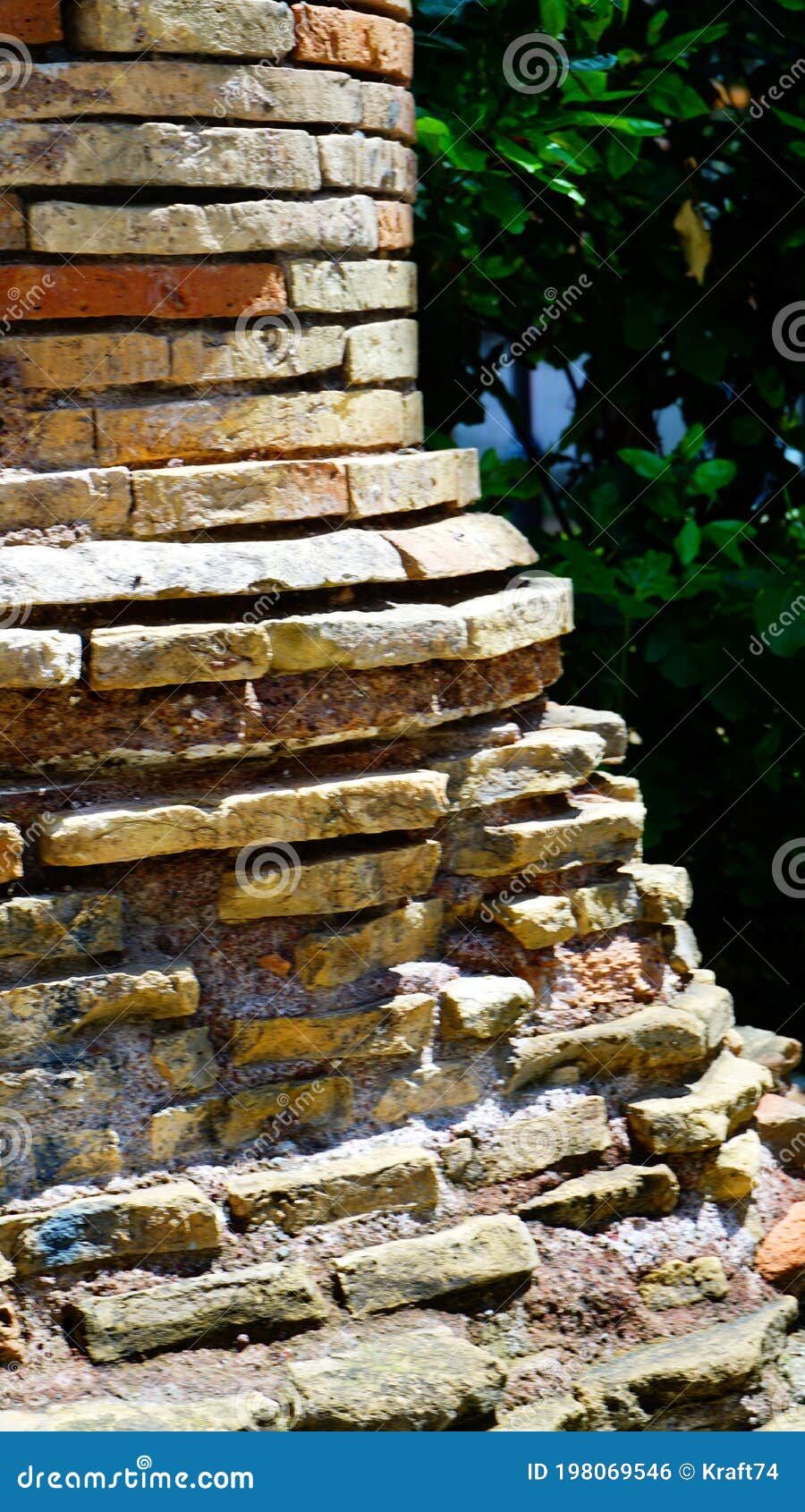 Rounded Corner of Ancient Brick Wall and Stone Scraps with a Geometric ...