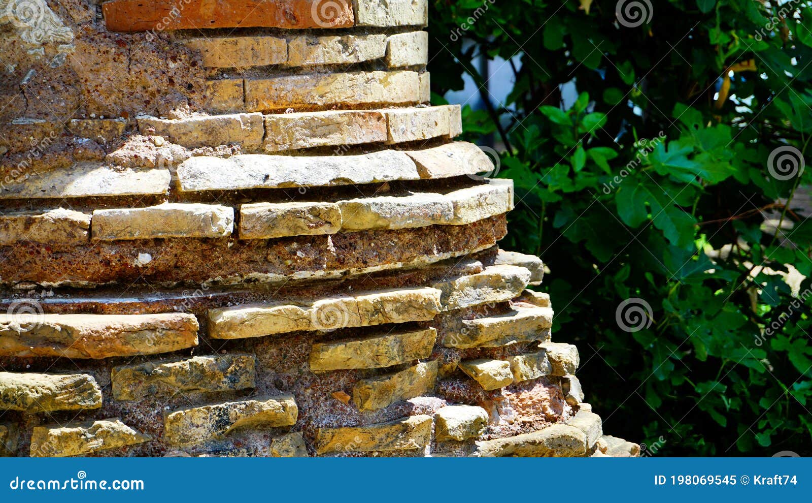 Rounded Corner of Ancient Brick Wall and Stone Scraps with a Geometric ...