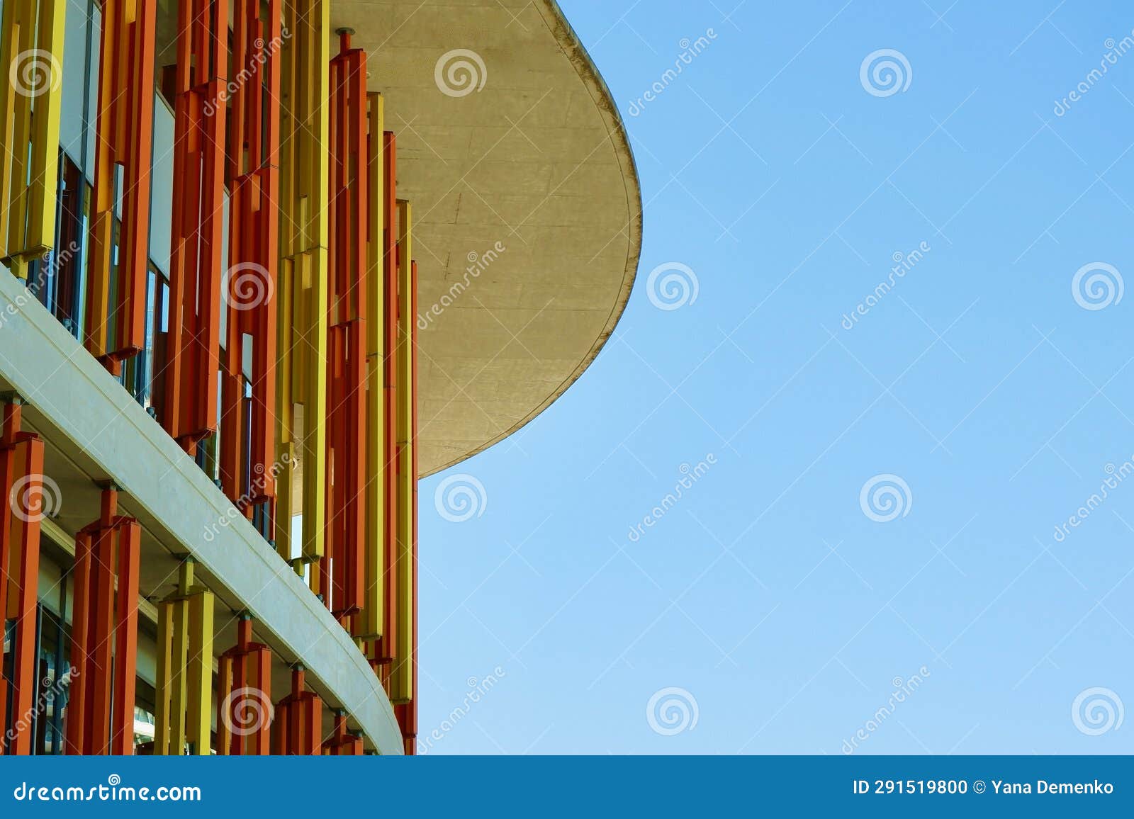 Rounded Corner of a Modern Building with Lined Architectural Elements ...