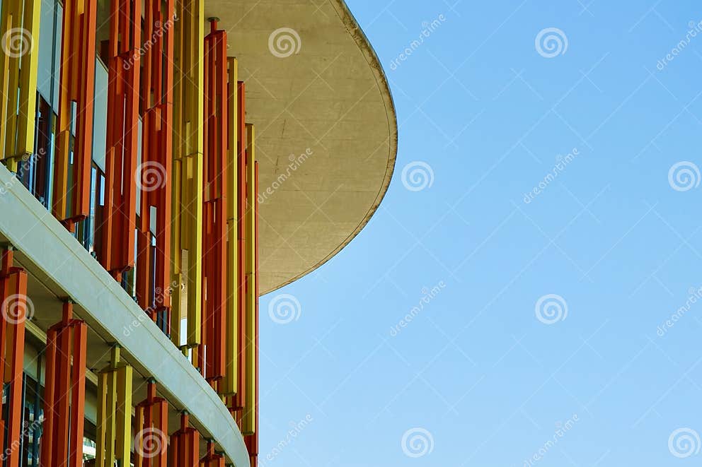 Rounded Corner of a Modern Building with Lined Architectural Elements ...