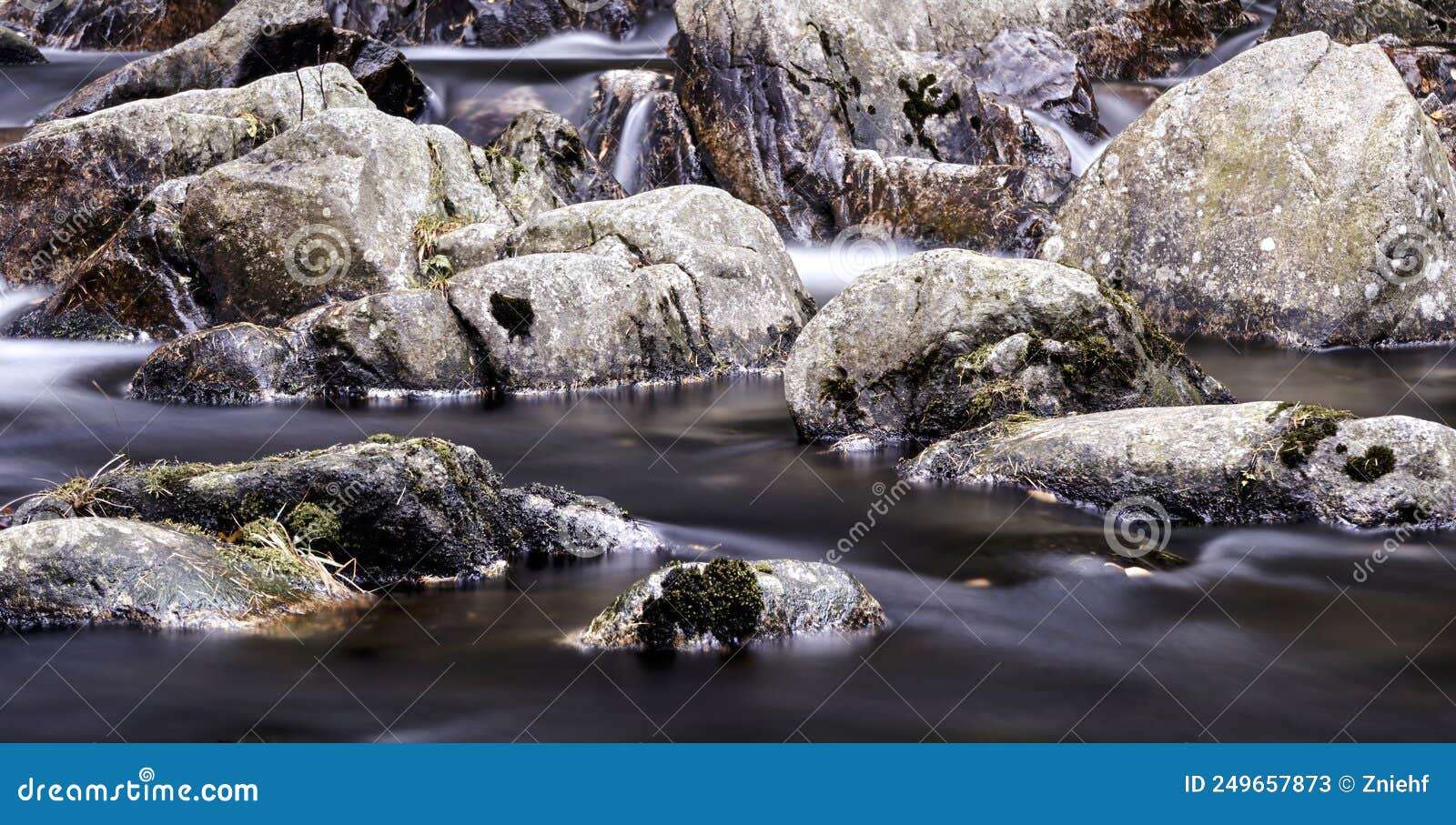 Rounded Granite Rocks in Stream Bed with Velvet Exposed Water Surface ...