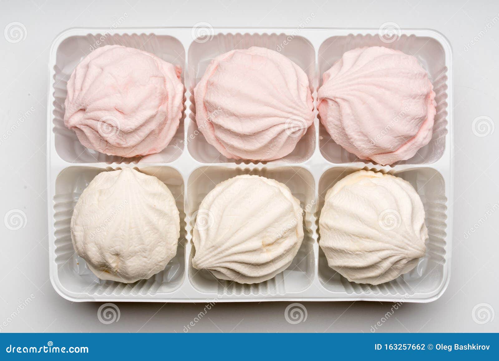 Rounded Multicolored Marshmallows in a Plastic Package on a White ...