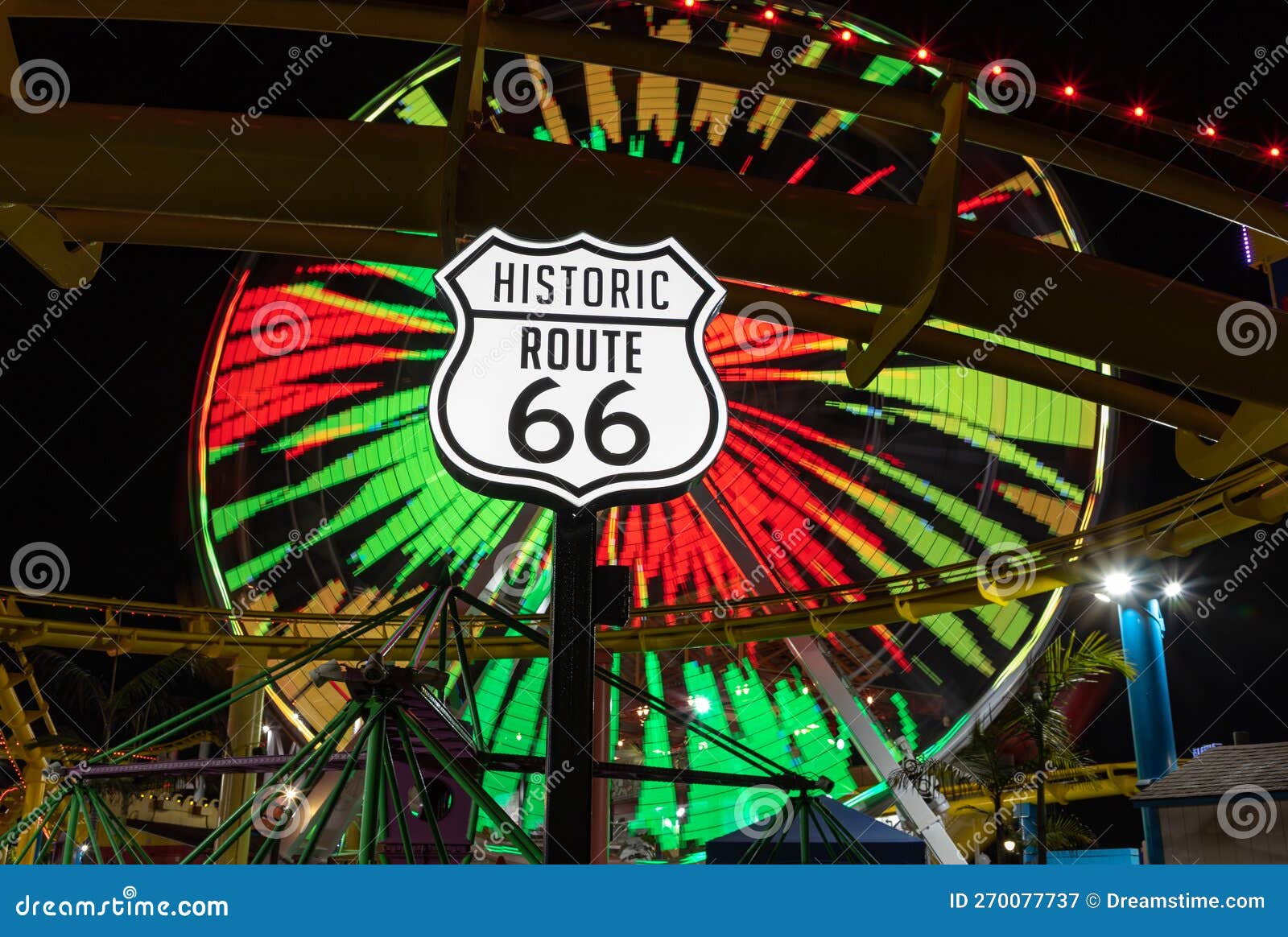 Route 66 Sign and Pacific Wheel at Night Editorial Photography - Image ...