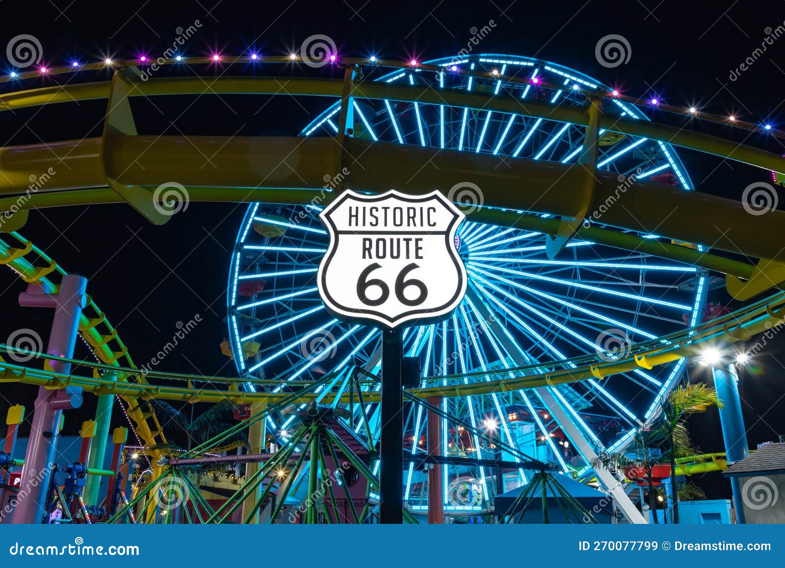 Route 66 Sign and Pacific Wheel at Night Editorial Stock Image - Image ...