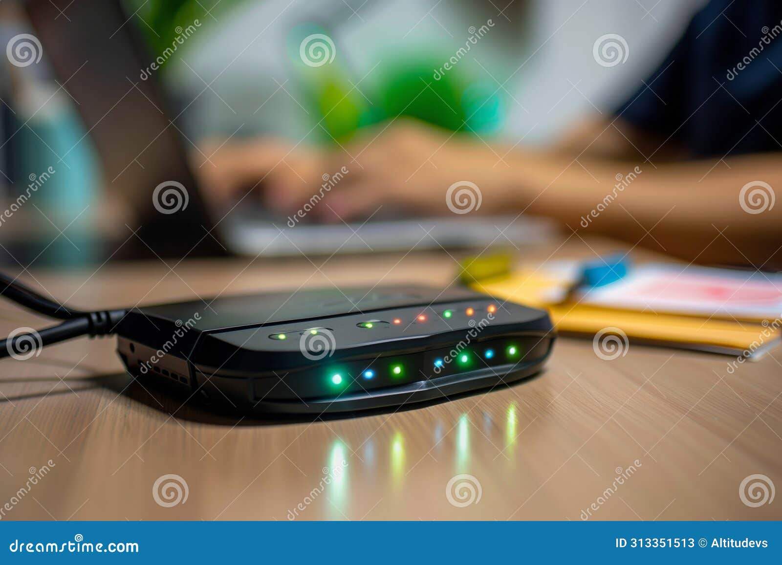Router with Blinking Lights on a Desk, Person Typing in the Background ...