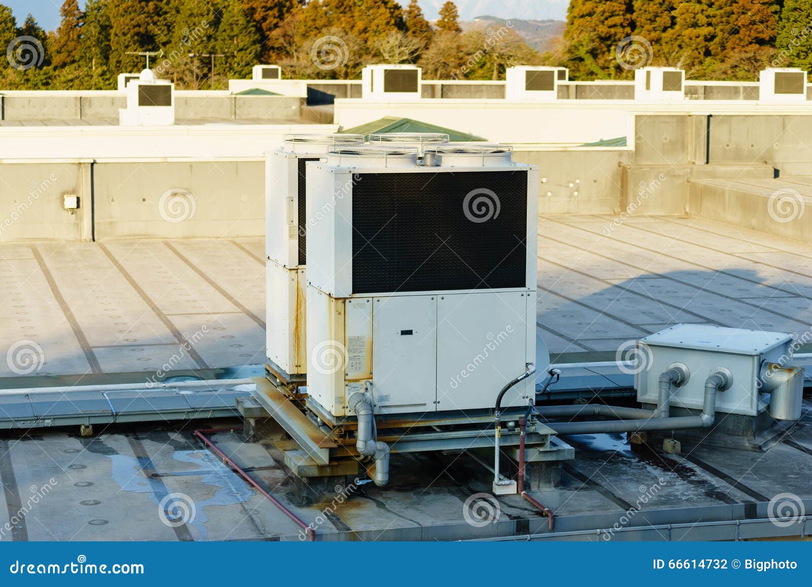A Row of Air Conditioning Units on a Rooftop. Stock Photo - Image of ...