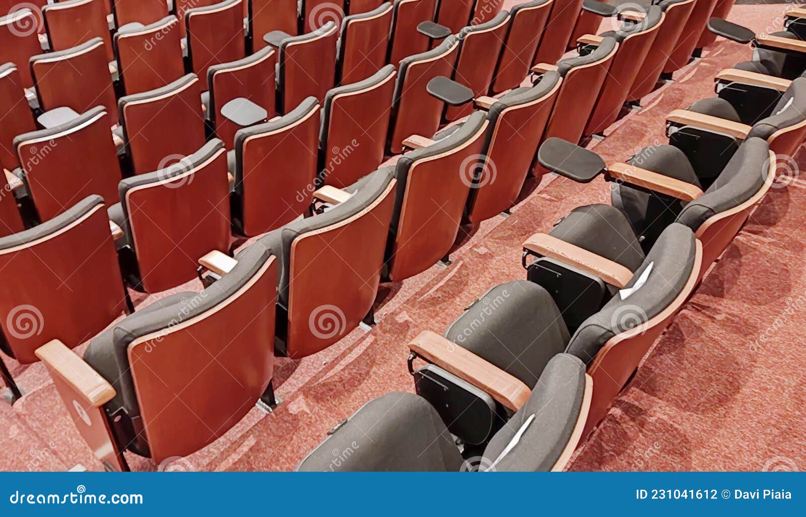 Row of amphitheater chairs stock photo. Image of room - 231041612