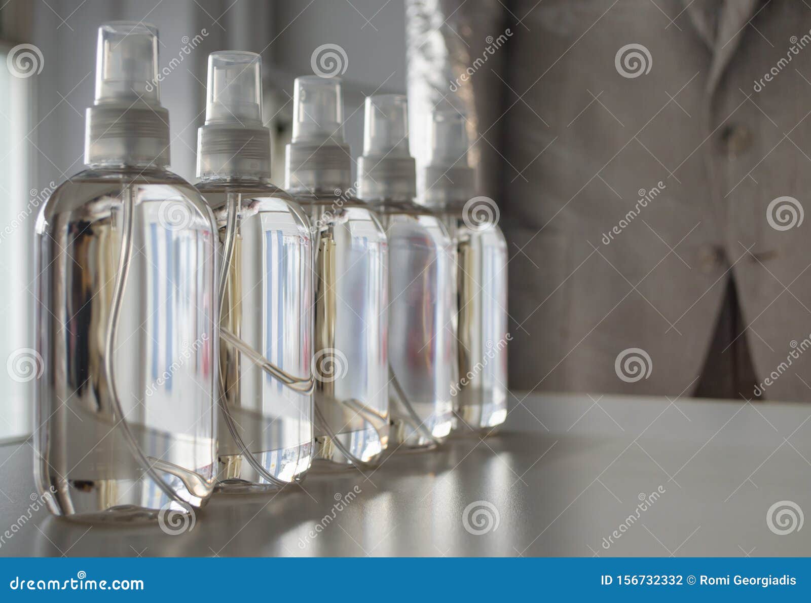 Row of Atomizer Plastic Bottles with Clothes Fragrance Stock Photo ...