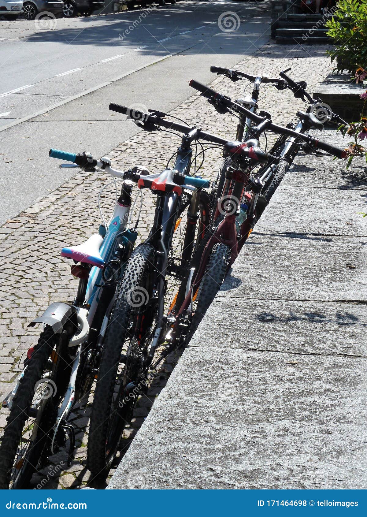 A Row of Bicycles Leaning Against a Wall Editorial Stock Photo - Image ...