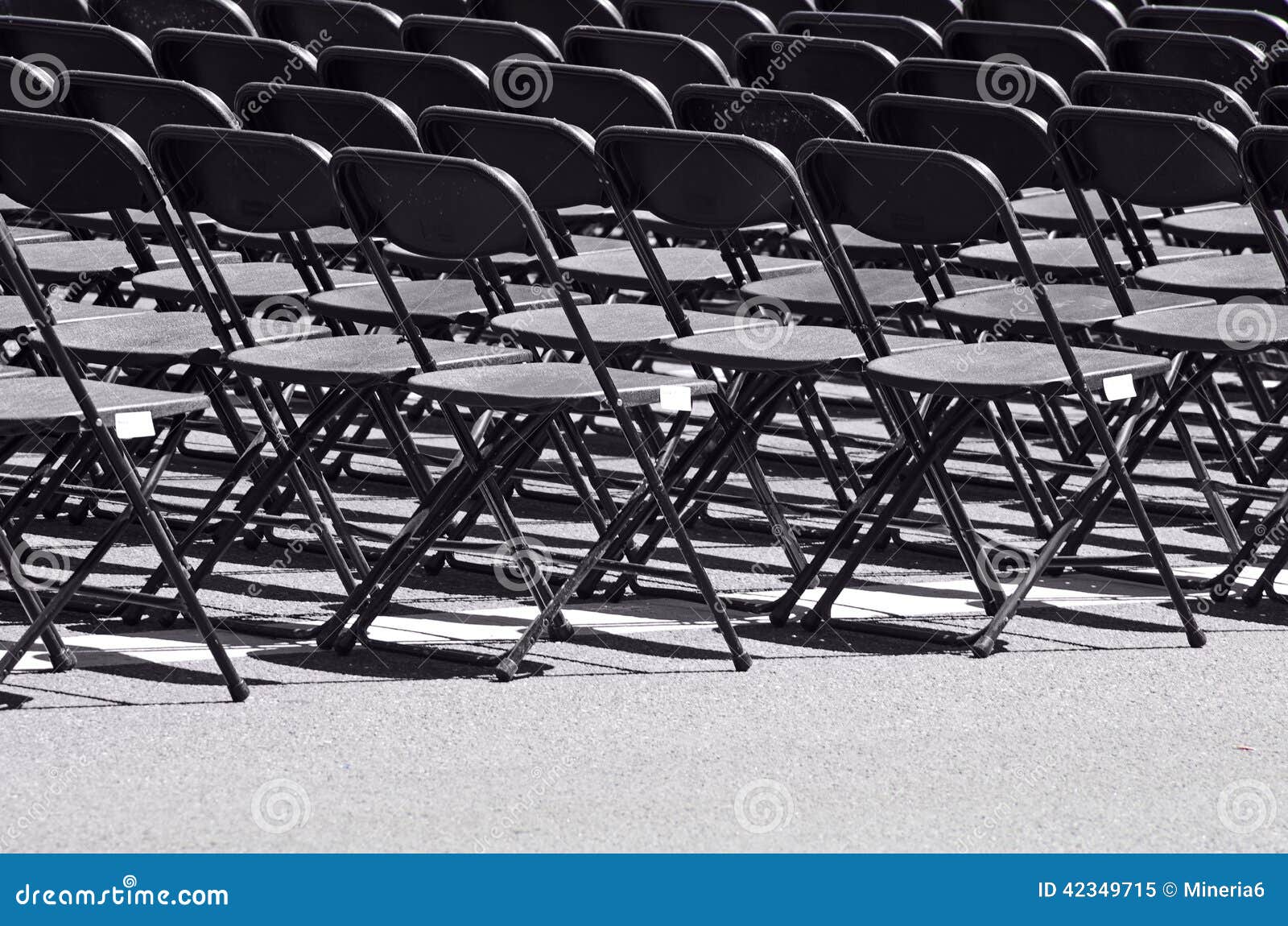 Row of black empty chairs stock image. Image of outside - 42349715