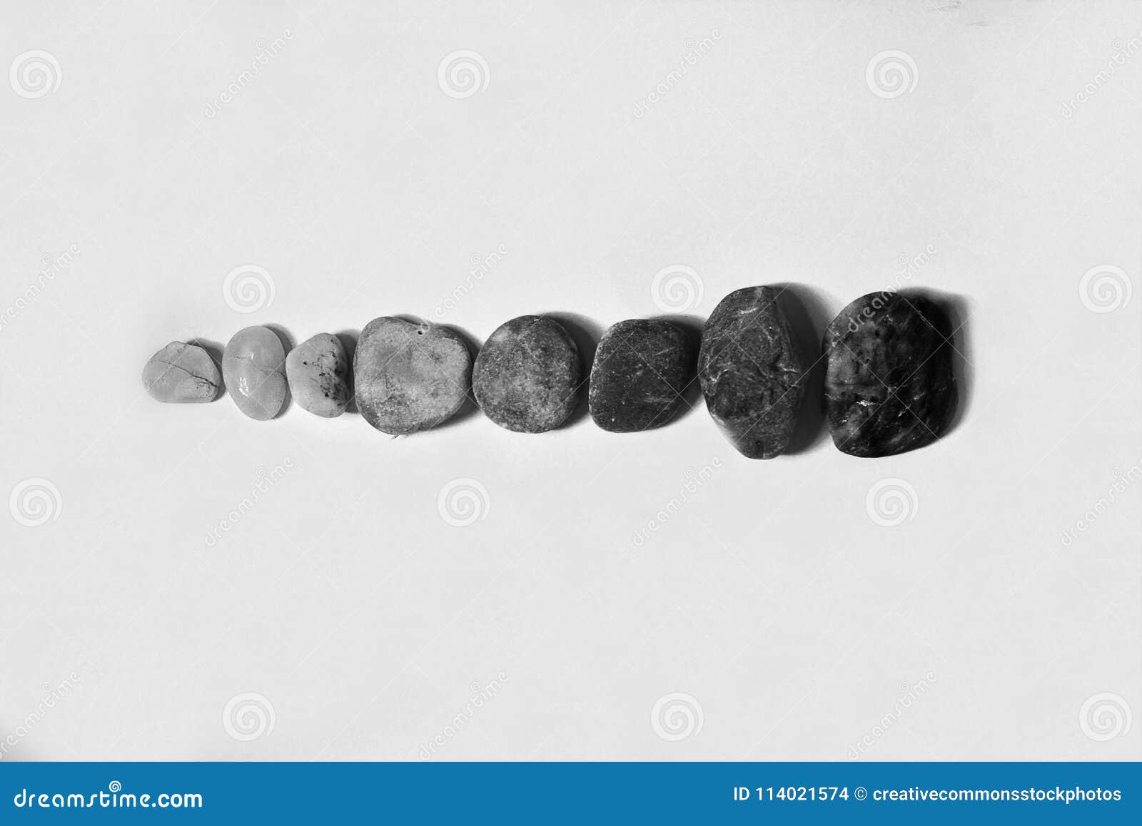 Row Of Black And Gray Polished Pebble On Gray Surface Picture. Image ...
