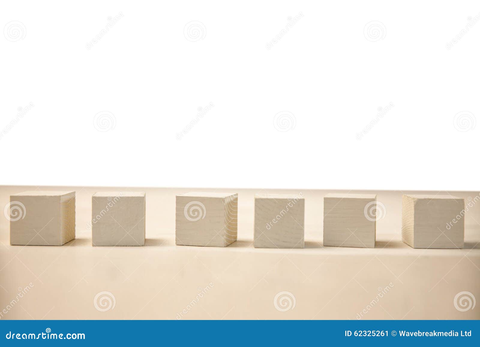 Row of blocks on table stock image. Image of white, block - 62325261