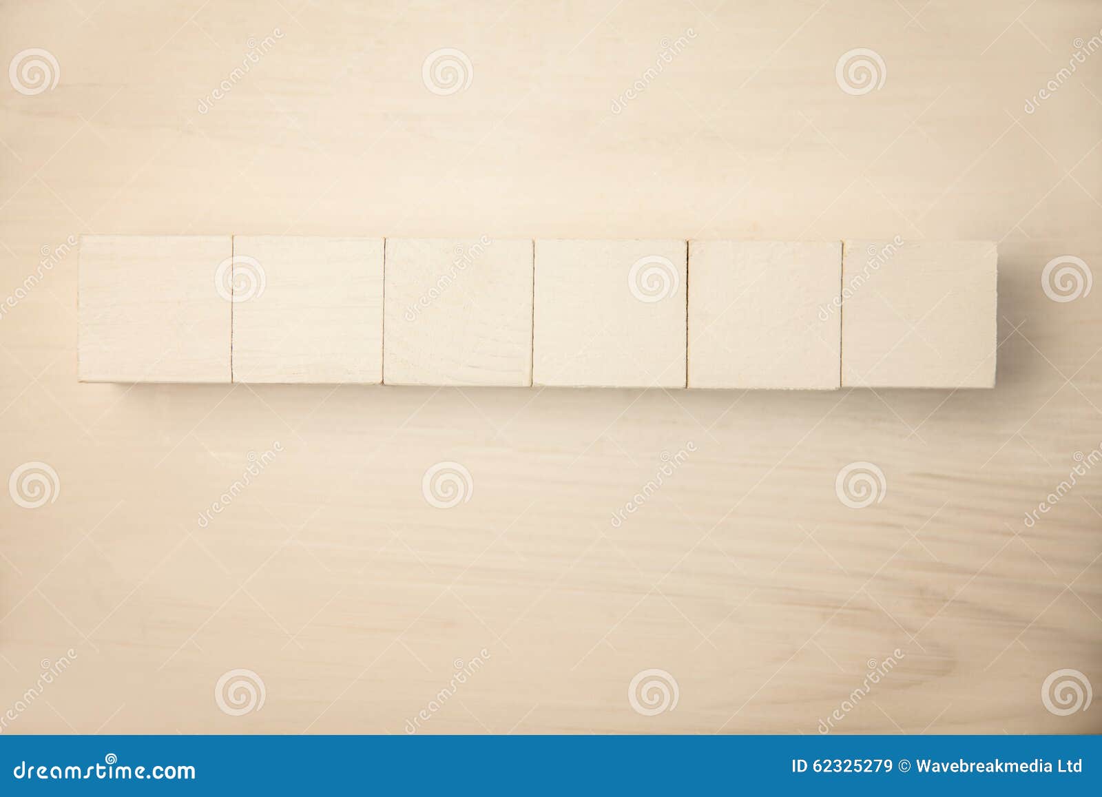 Row of blocks on table stock image. Image of building - 62325279
