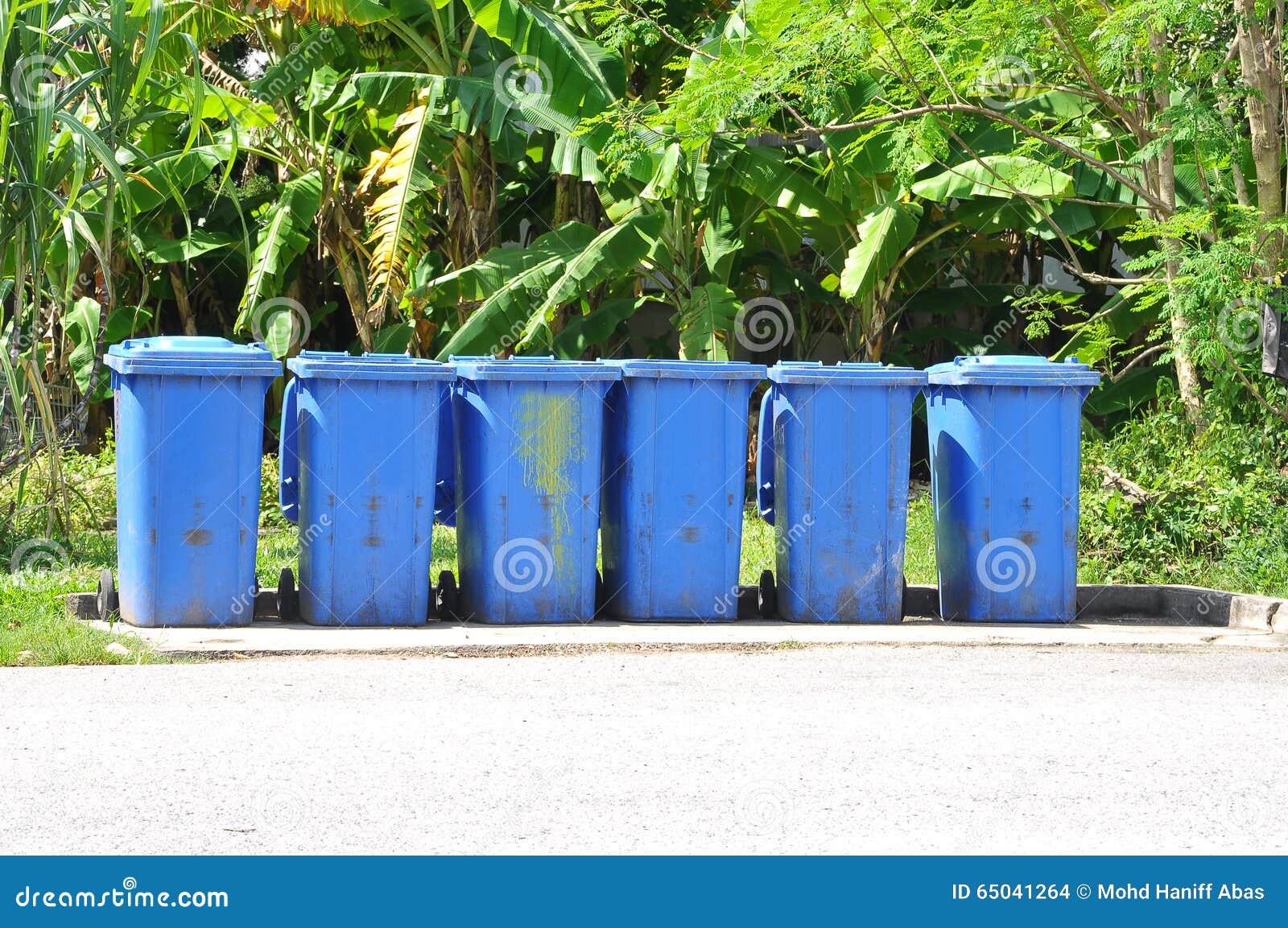 Row of Blue Dustbin by the Roadside Stock Photo - Image of rubbish ...