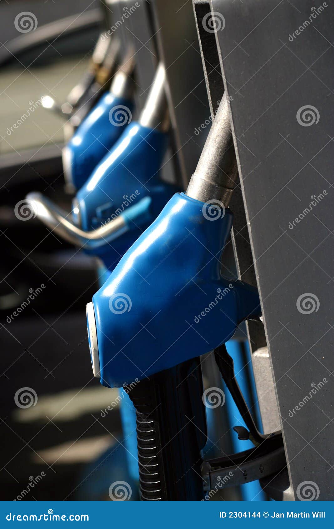Row of Blue Gas Pump Nozzles Stock Photo - Image of nozzle, pumps: 2304144