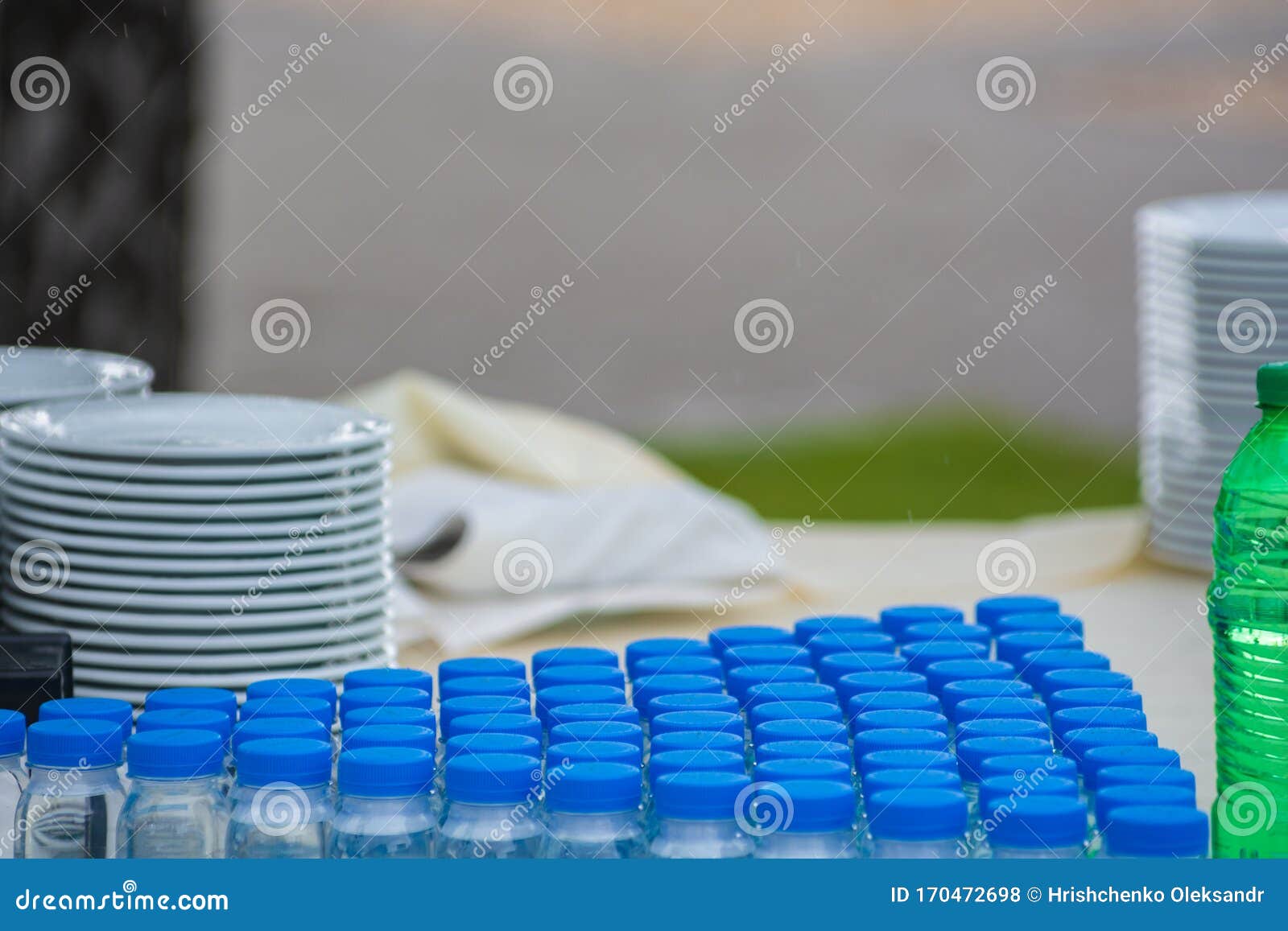 A Row of Blue Mineral Water Bottle Caps Stock Photo - Image of plates ...