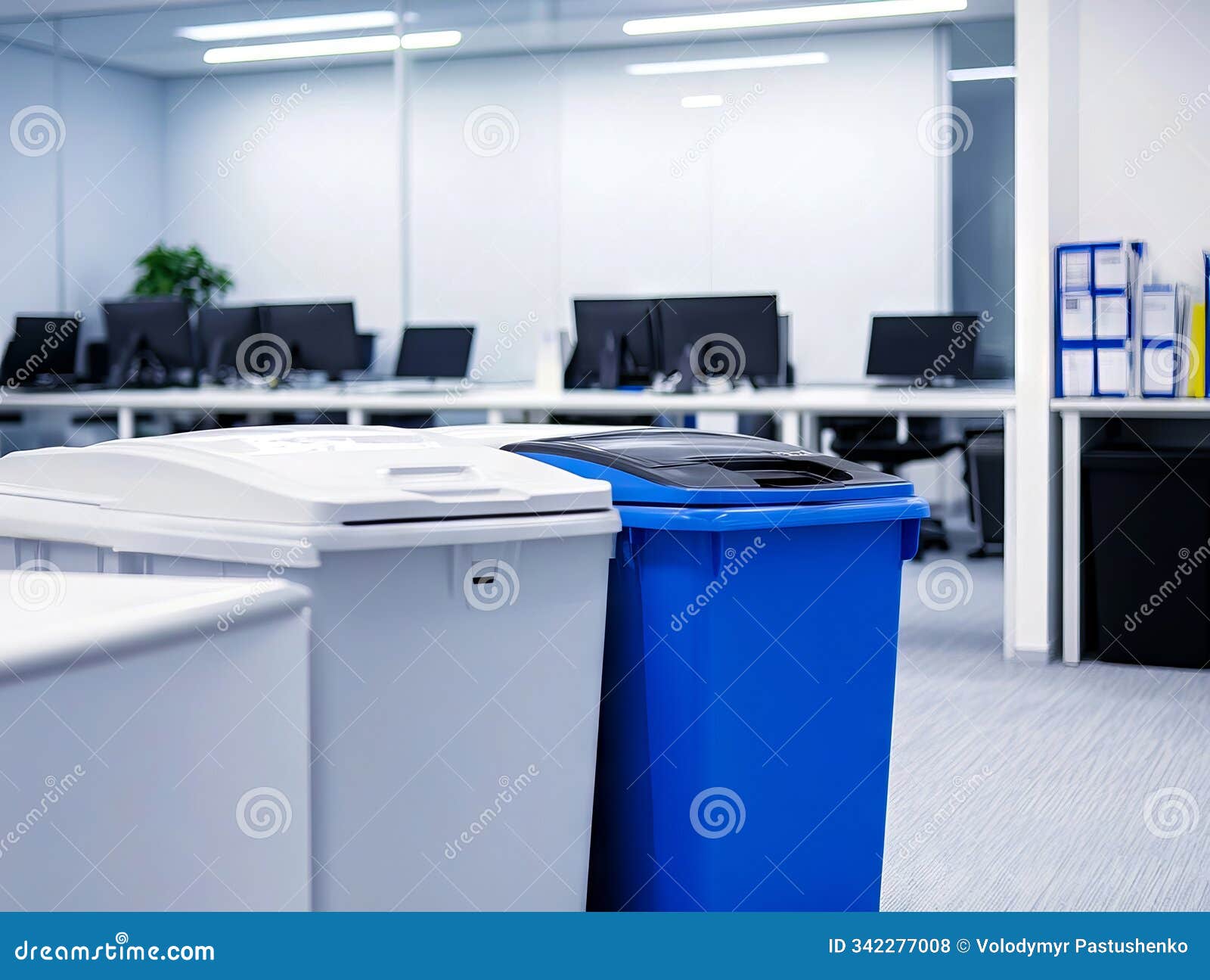 A Row of Blue and White Trash Cans in an Office Setting Stock Photo ...