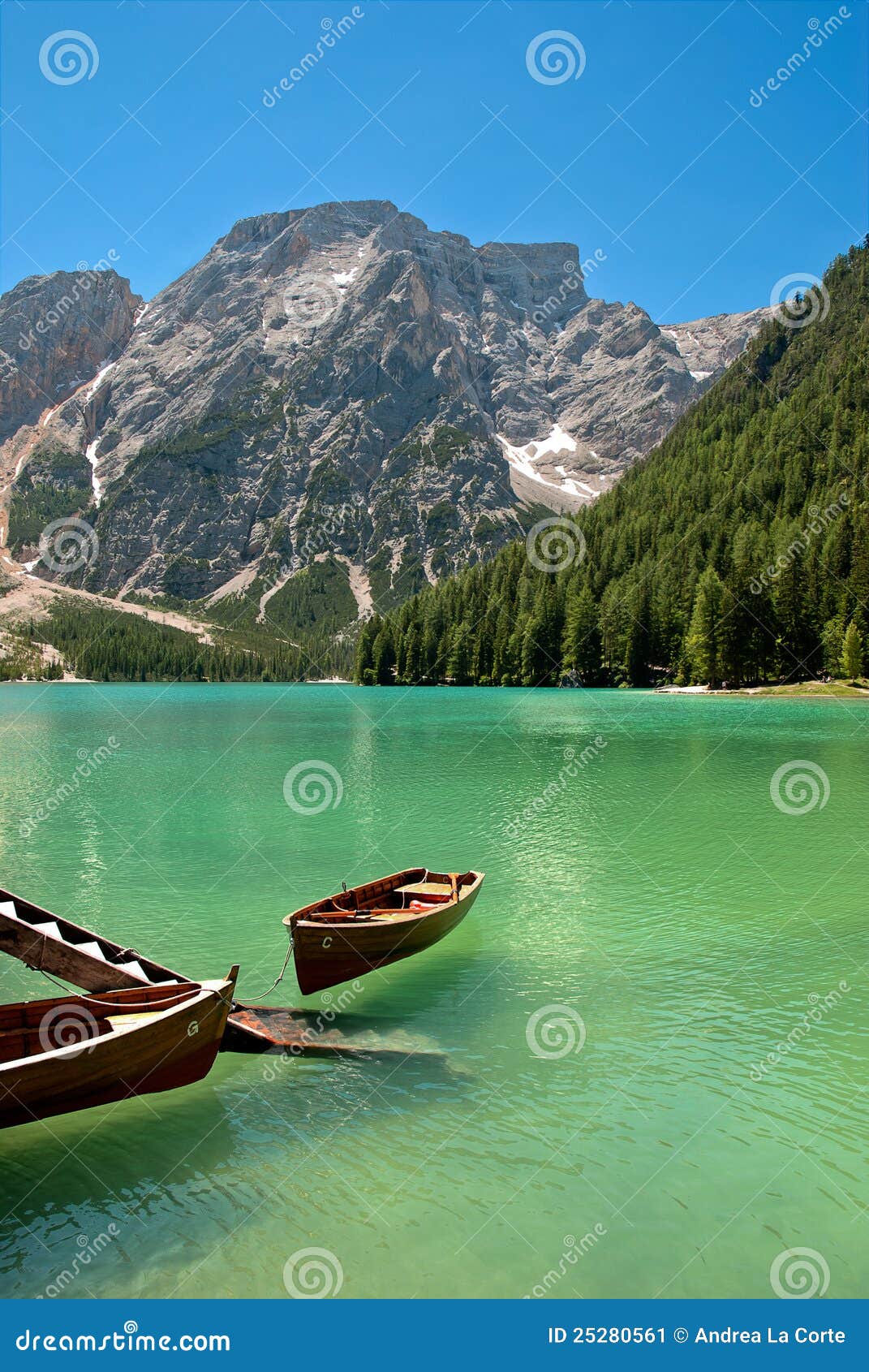Row Boat on a Lake with Mountains in he Background Stock Image - Image ...