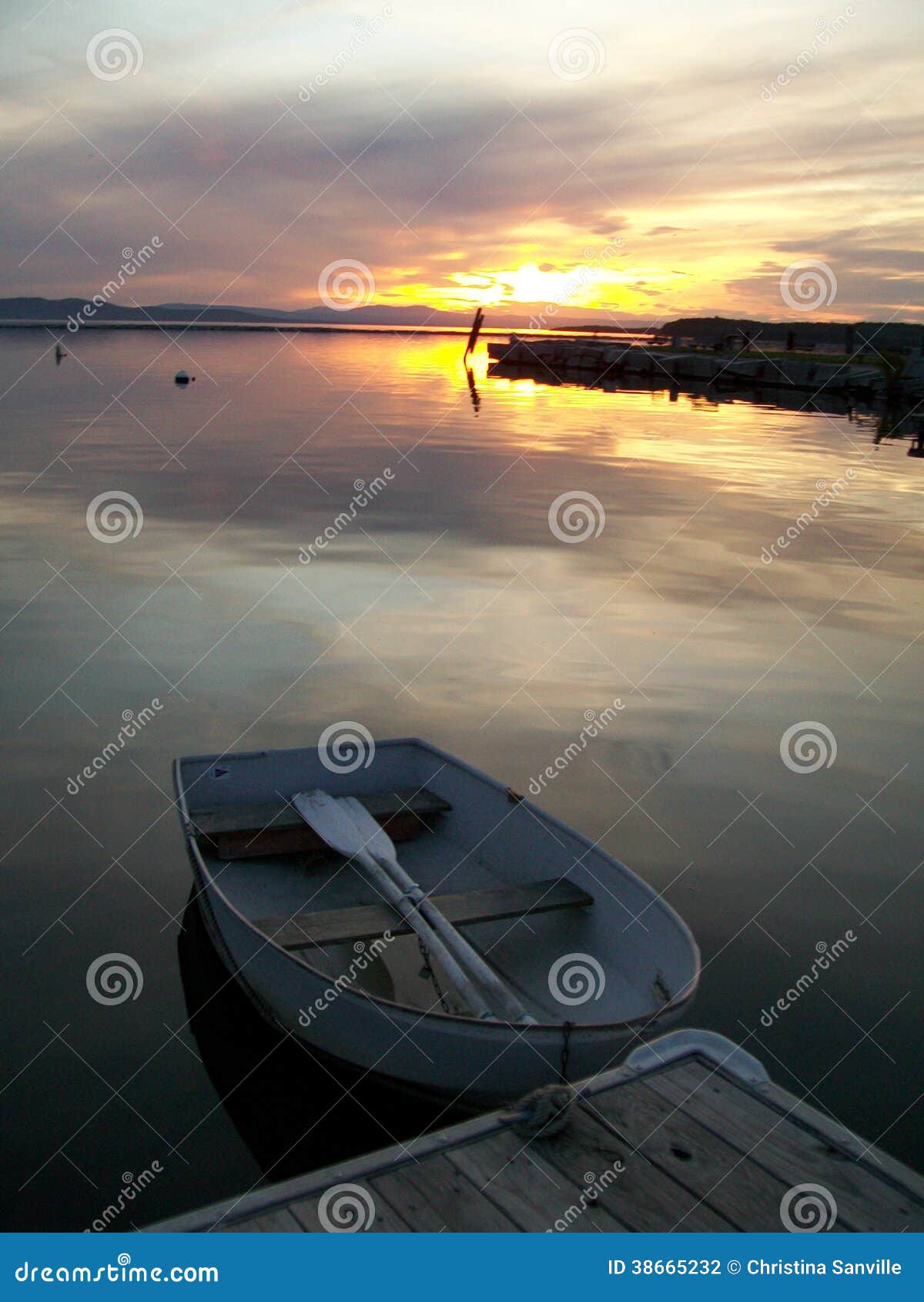 A row boat at sunset stock photo. Image of boat, calm - 38665232