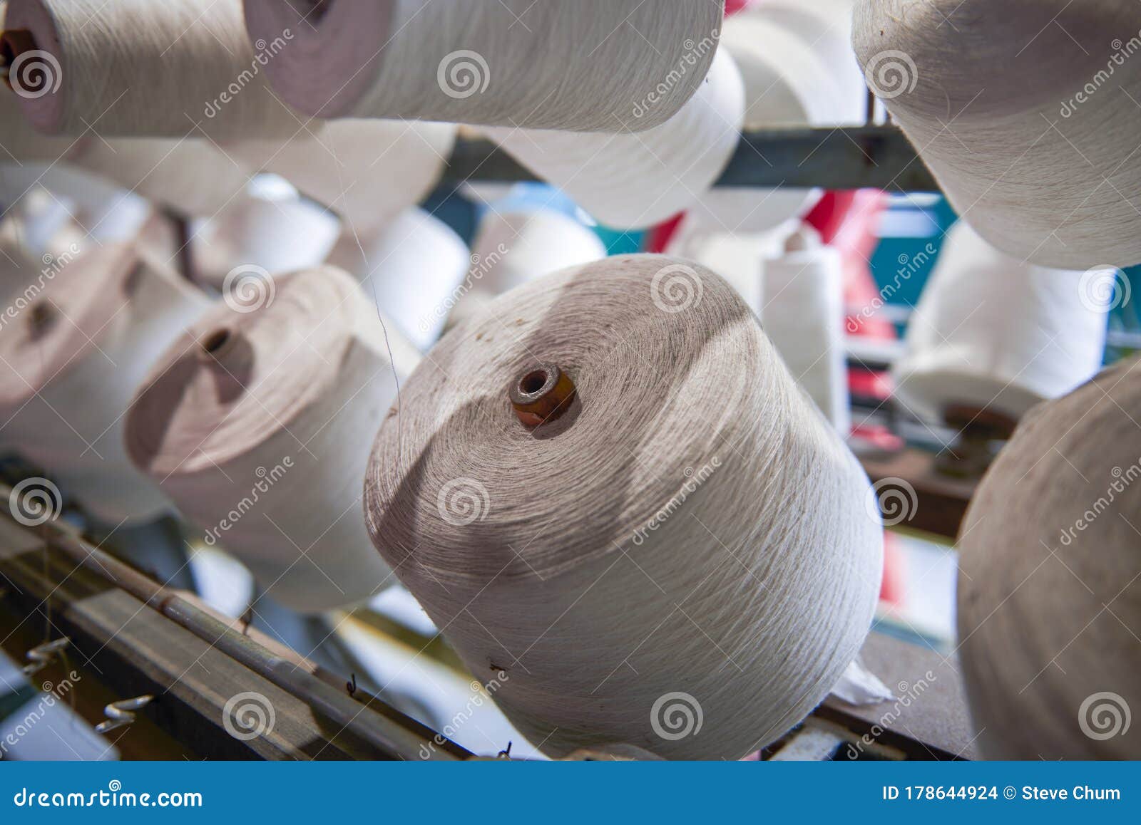 A Row of Bobbins on a Cotton Spinning Machine Stock Photo - Image of ...