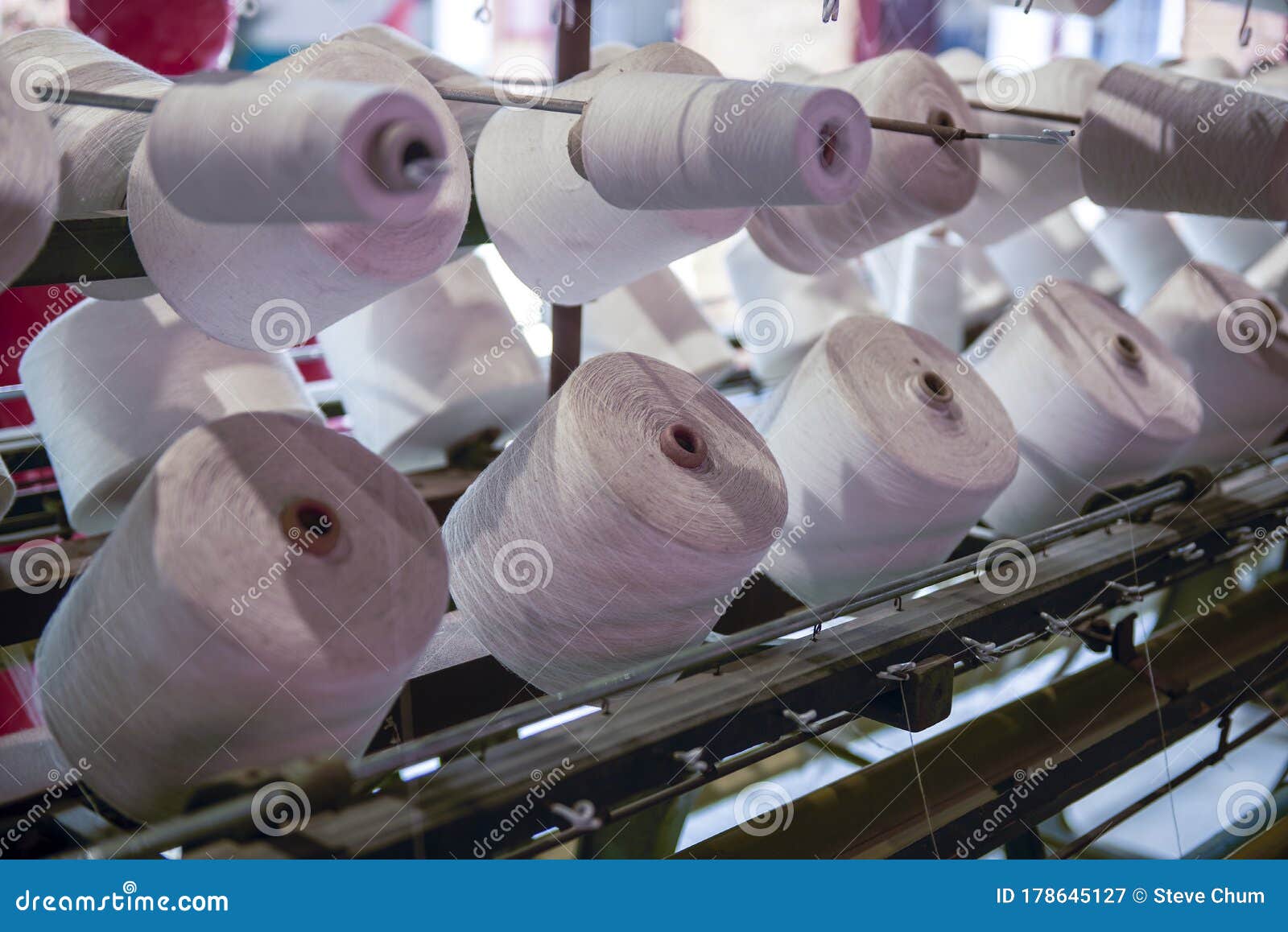 A Row of Bobbins on a Cotton Spinning Machine Stock Image - Image of ...