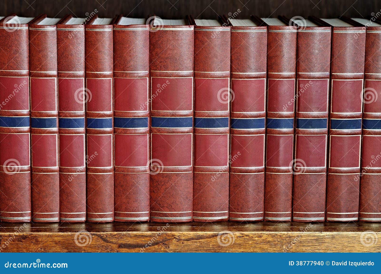 Row of books on a shelf stock photo. Image of leatherette - 38777940