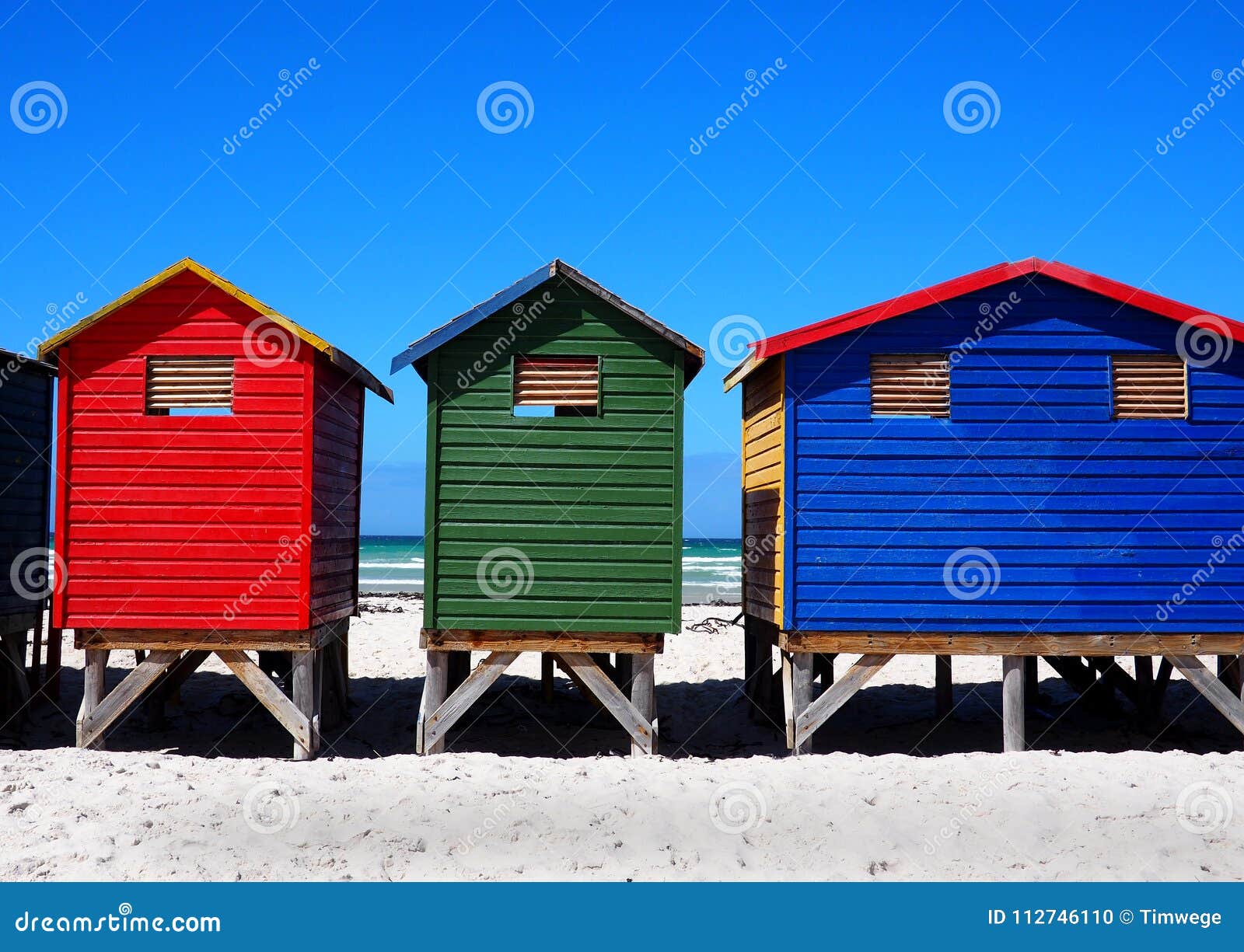 Row of colored beach huts stock photo. Image of room - 112746110