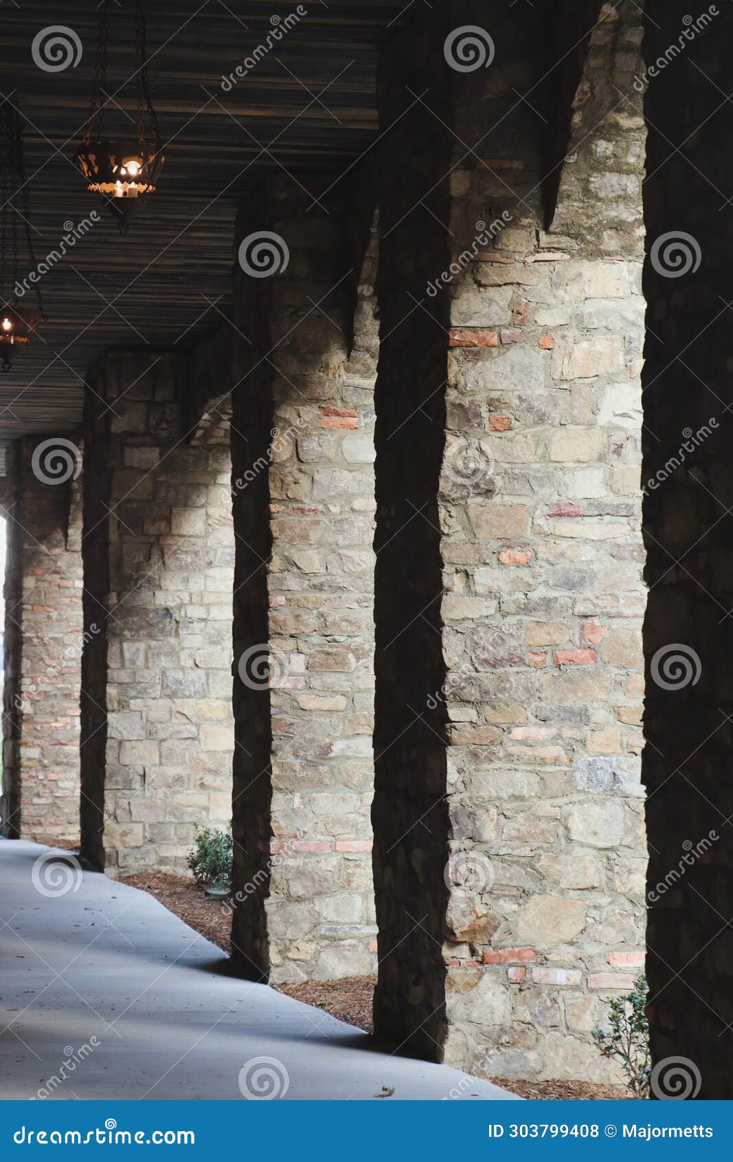 Row of Brown Stone Columns in Sunlight and Shadow Stock Photo - Image ...