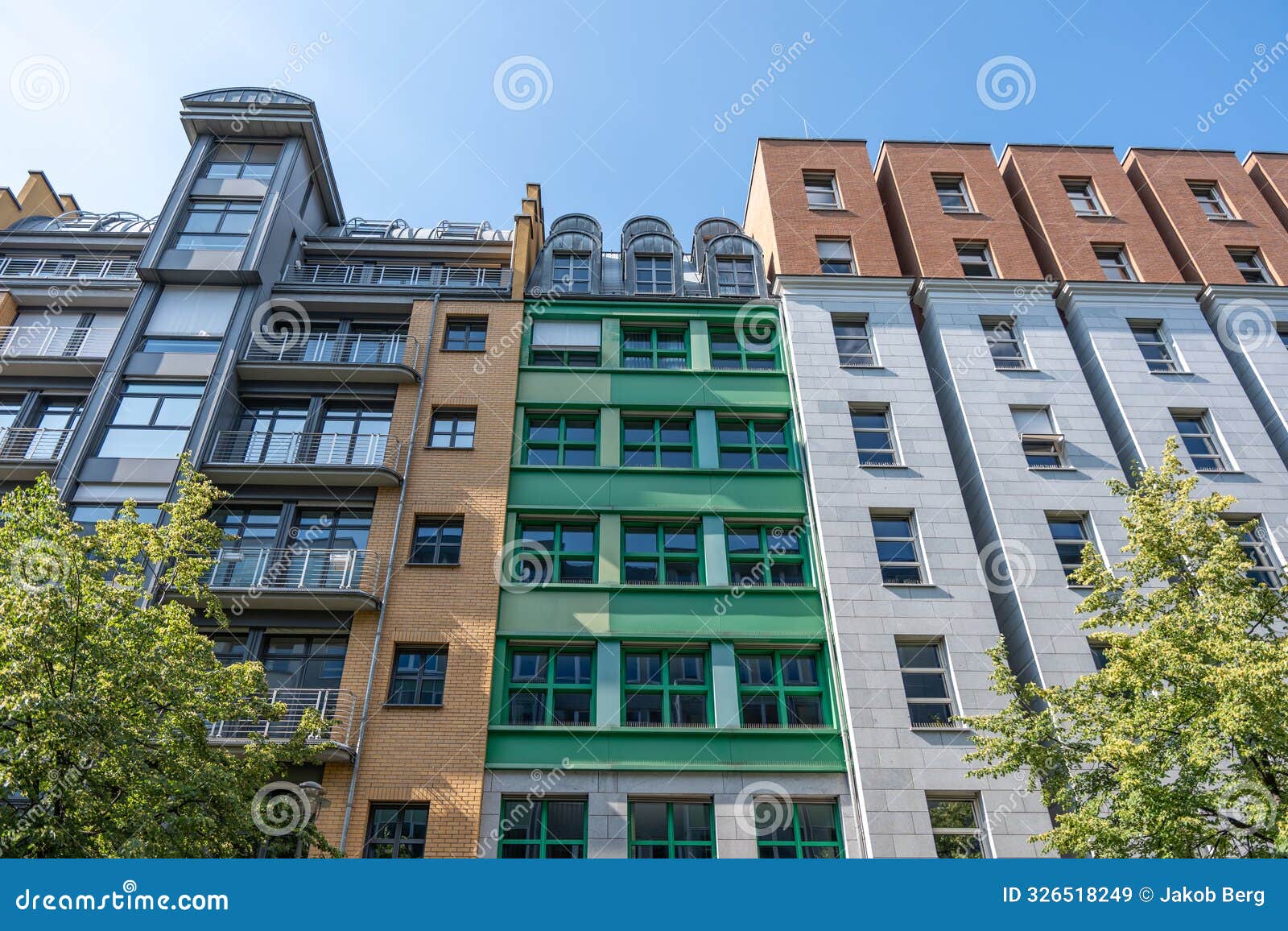 Row of Buildings with a Green Building in the Middle Stock Image ...