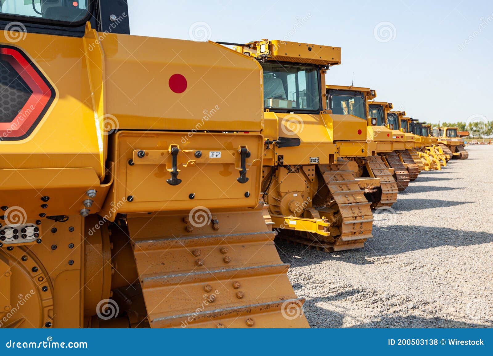 Row of Bulldozers in a Construction Site Stock Photo - Image of iron ...